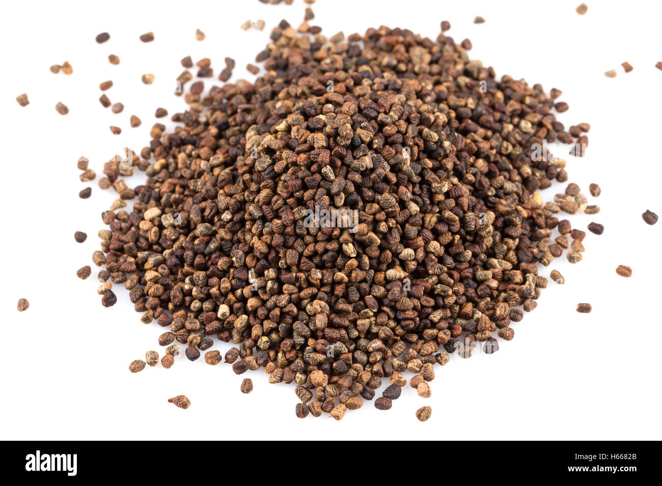 Decorticated cardamom seeds pile on a white background Stock Photo - Alamy
