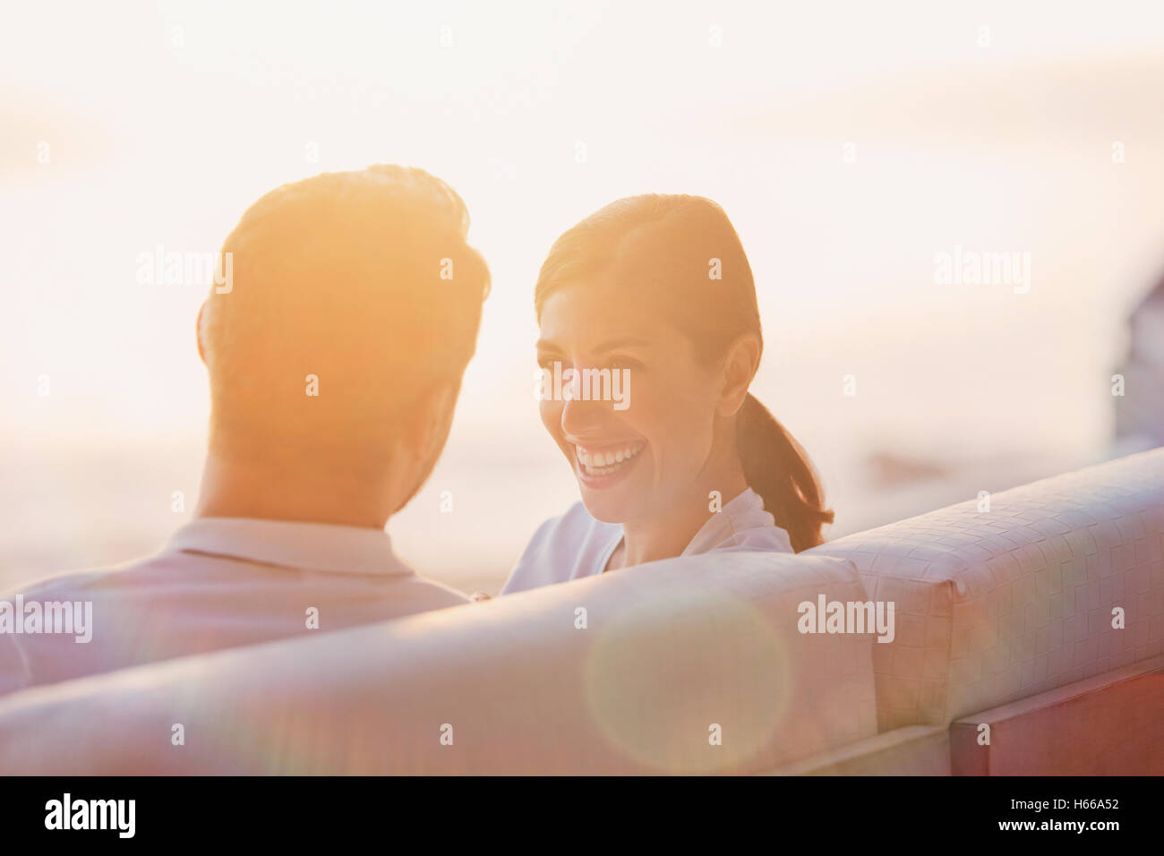 Young woman sunset on balcony hi-res stock photography and images - Alamy