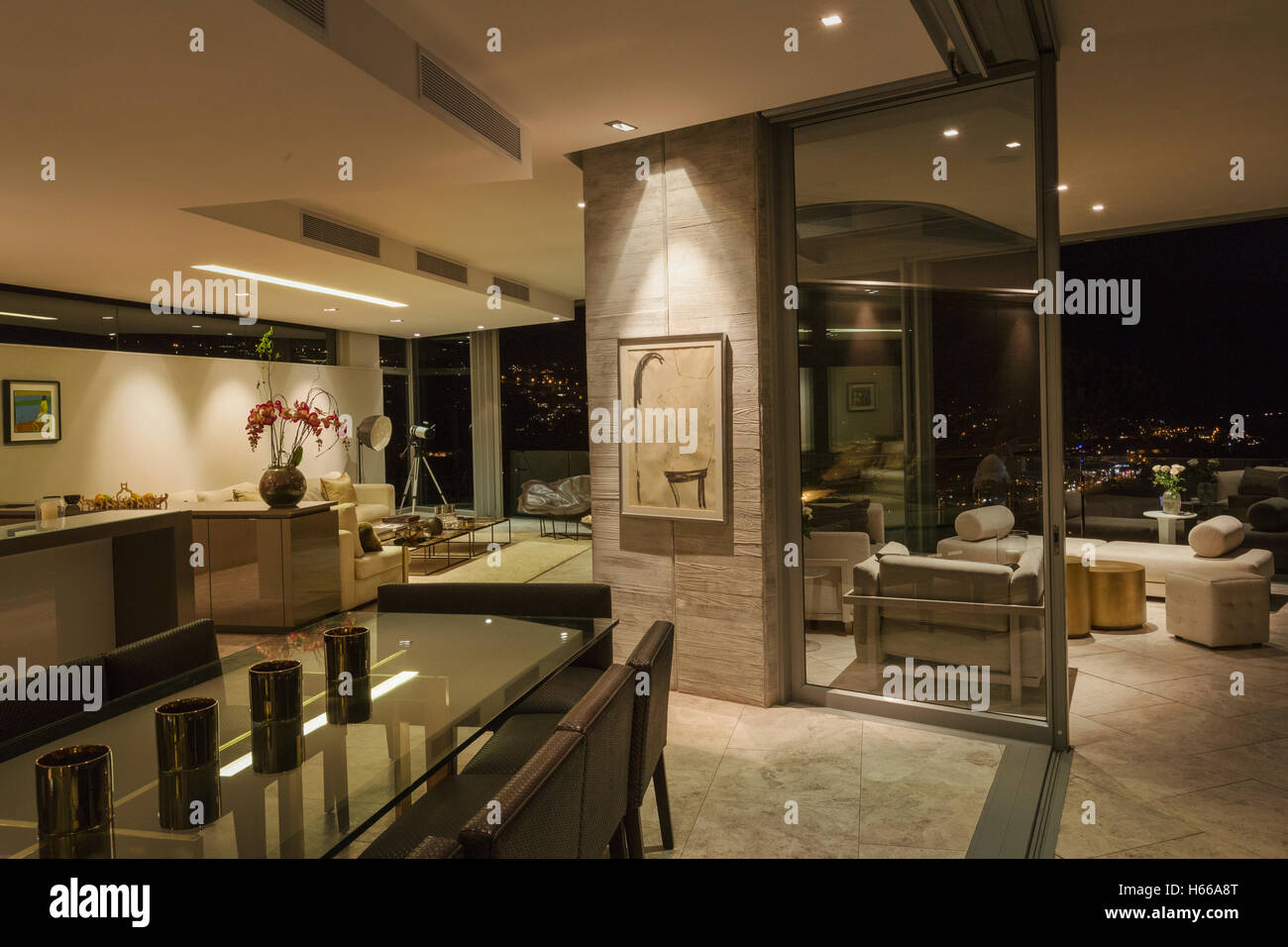 Illuminated modern luxury home showcase interior Stock Photo - Alamy