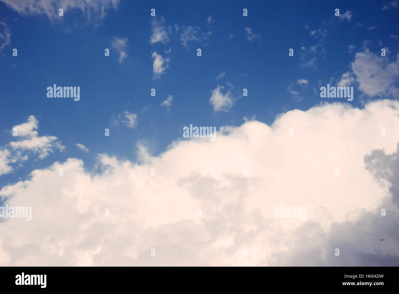 wight fuzzy clouds on bright blue sky Stock Photo - Alamy
