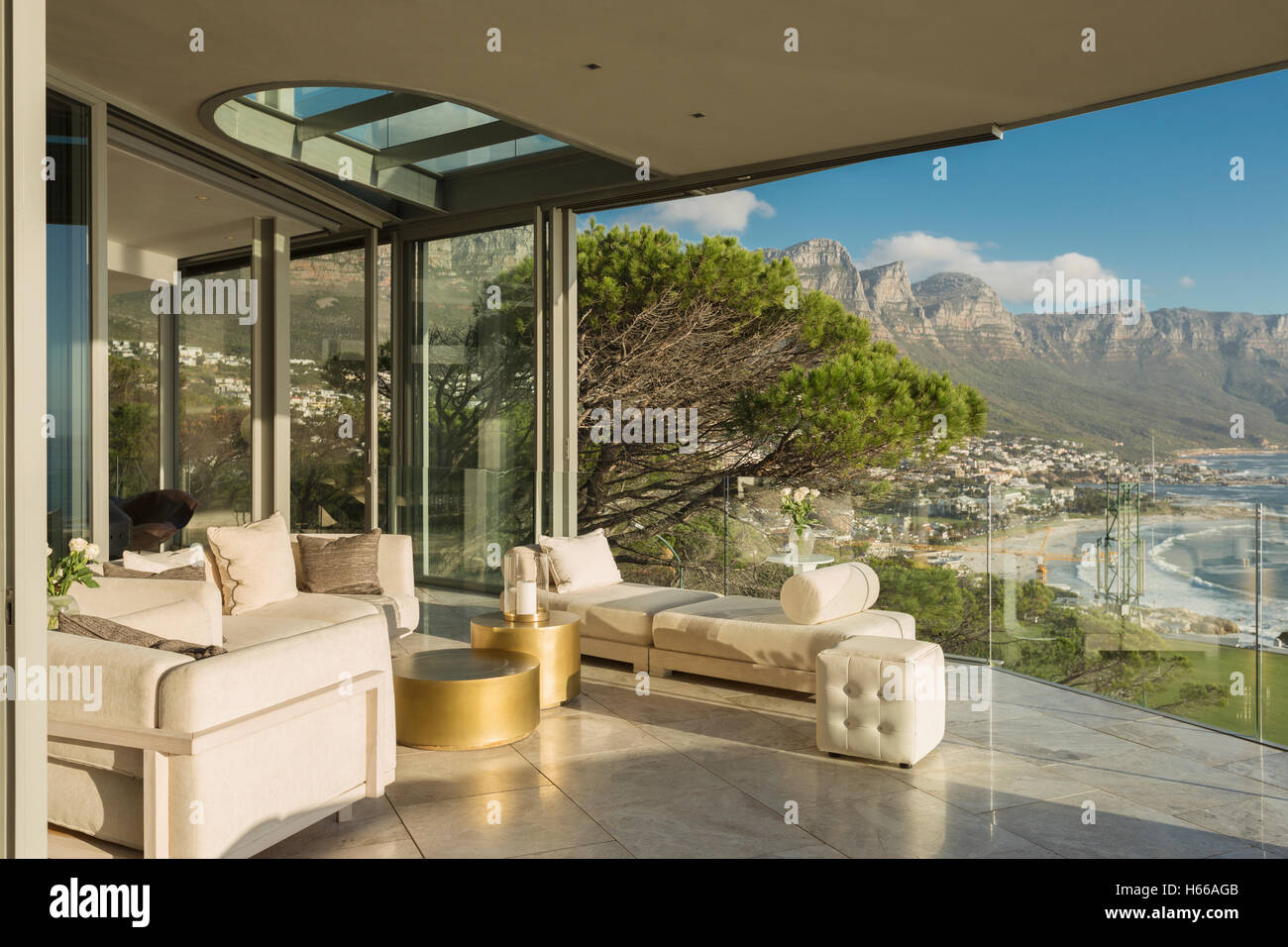 Sunny modern luxury home showcase balcony with mountain view Stock ...