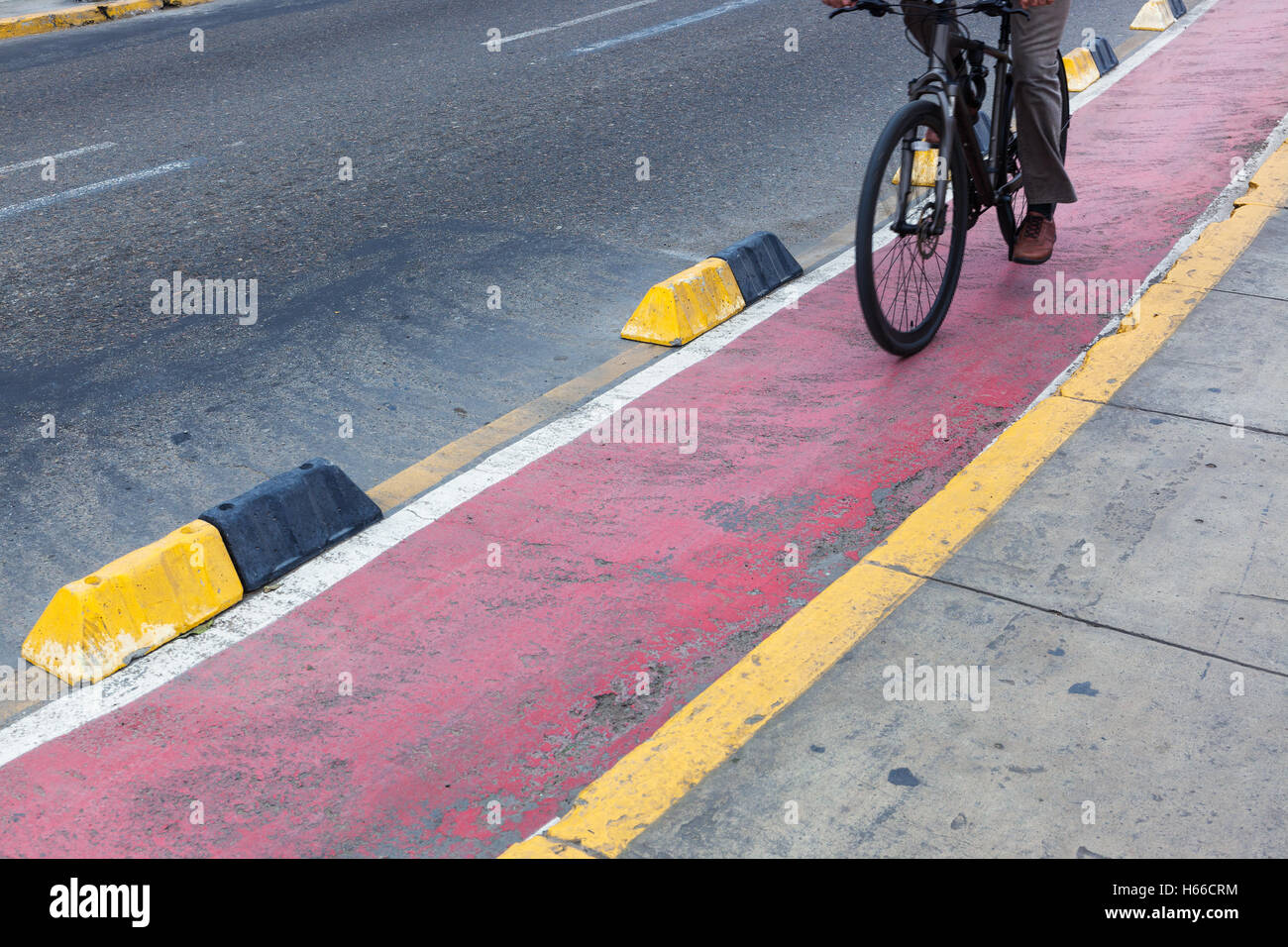 bicyclist red bike path in the modern city Stock Photo - Alamy
