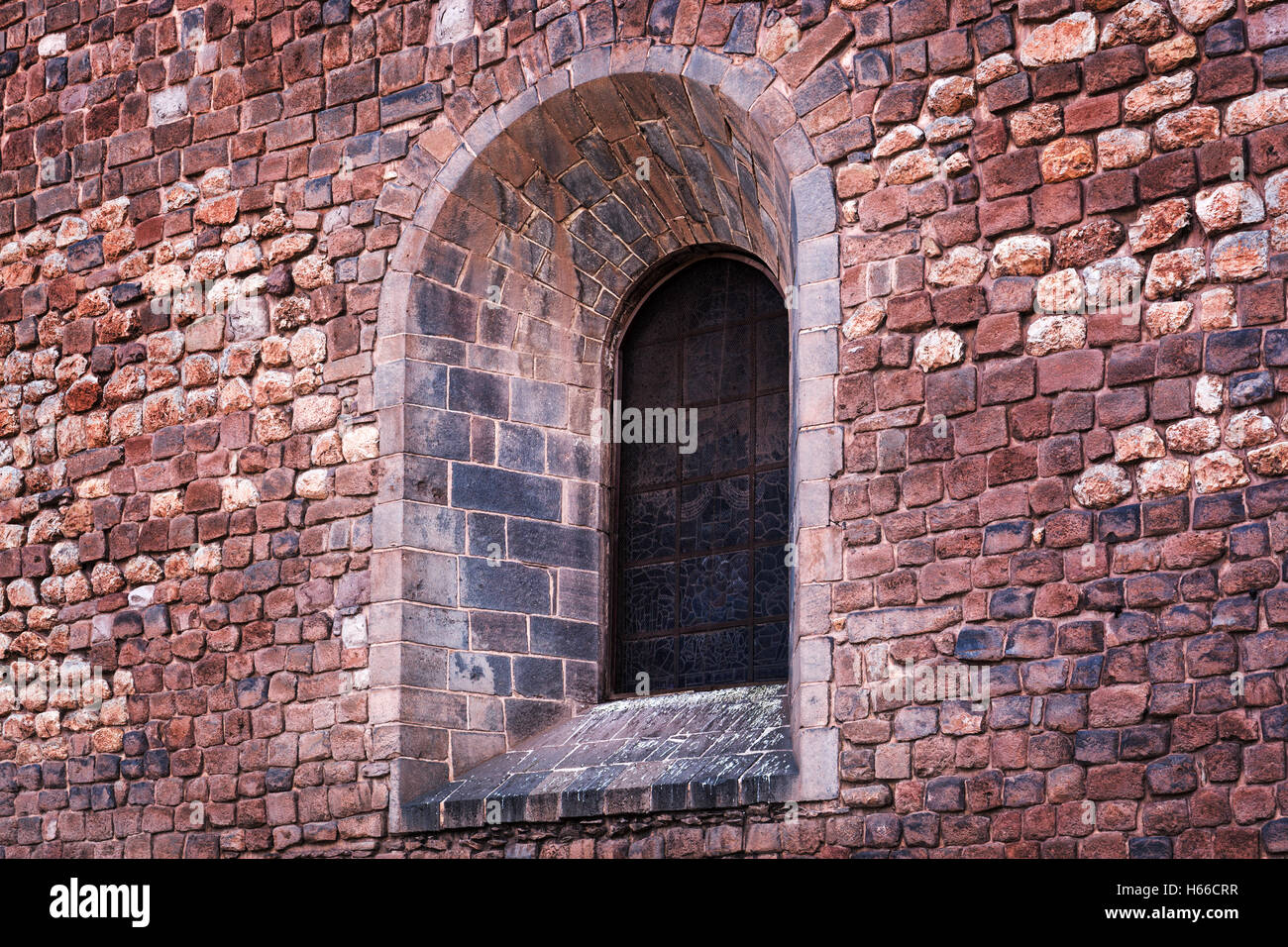 stained glass window in a brick building Stock Photo - Alamy