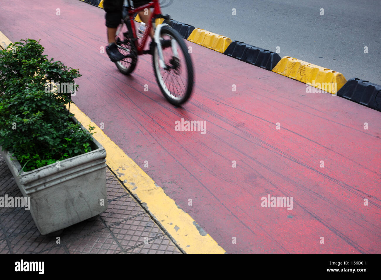 cyclist on a red bike path in modern city Stock Photo - Alamy