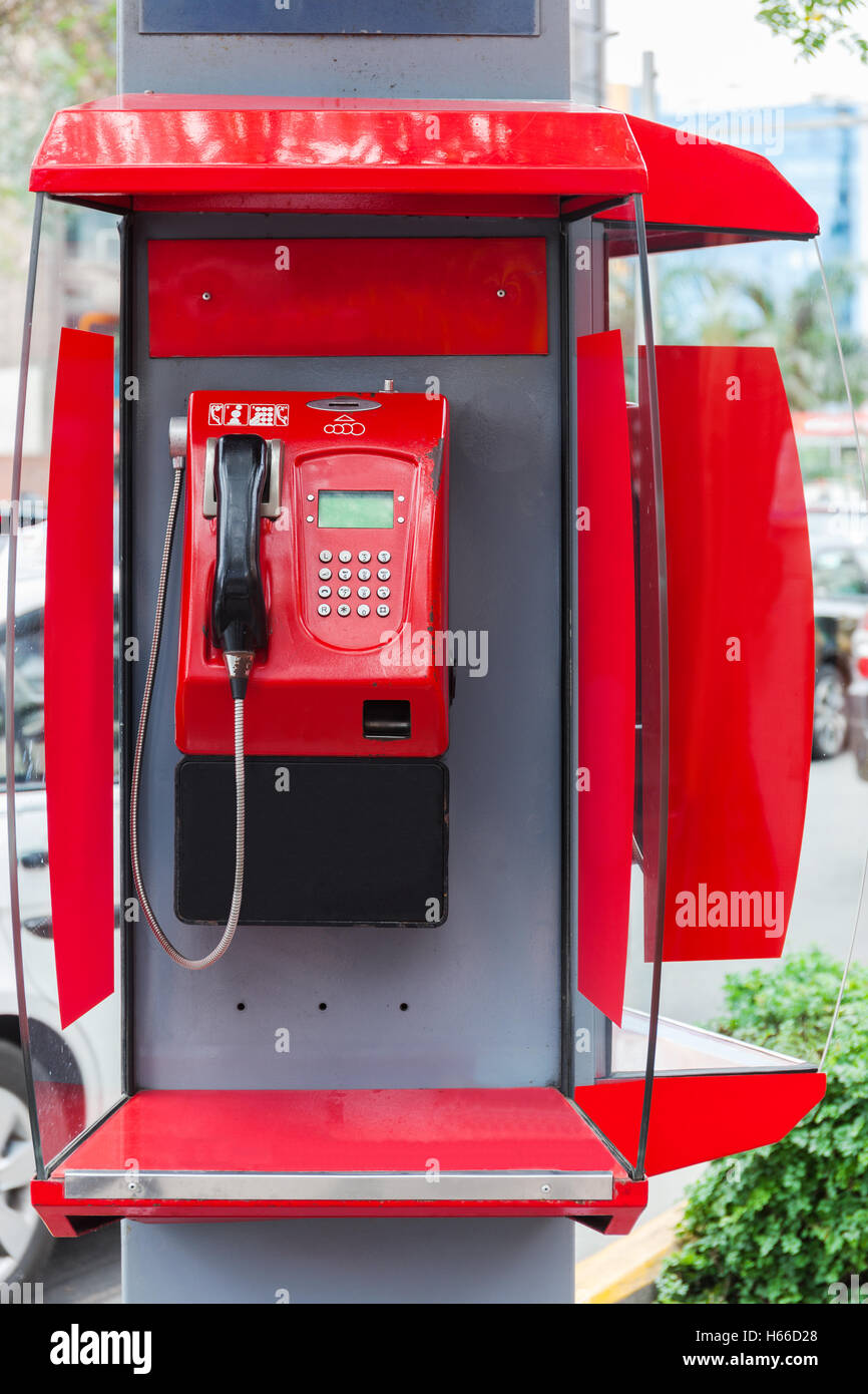 red payphone on a city street Stock Photo - Alamy