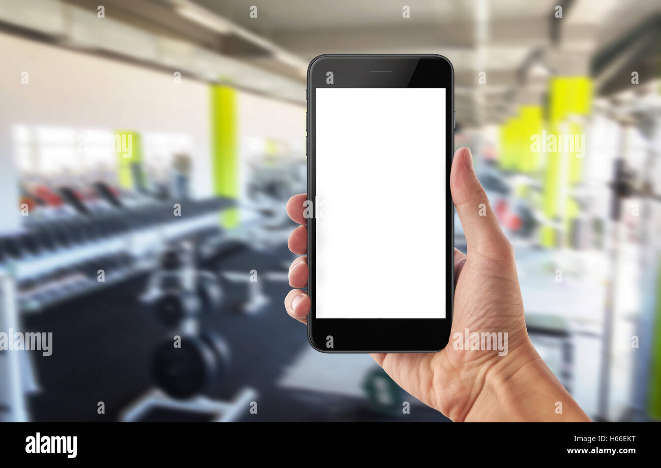 Mobile phone in sport gym. Isolated white screen for mockup Stock Photo ...