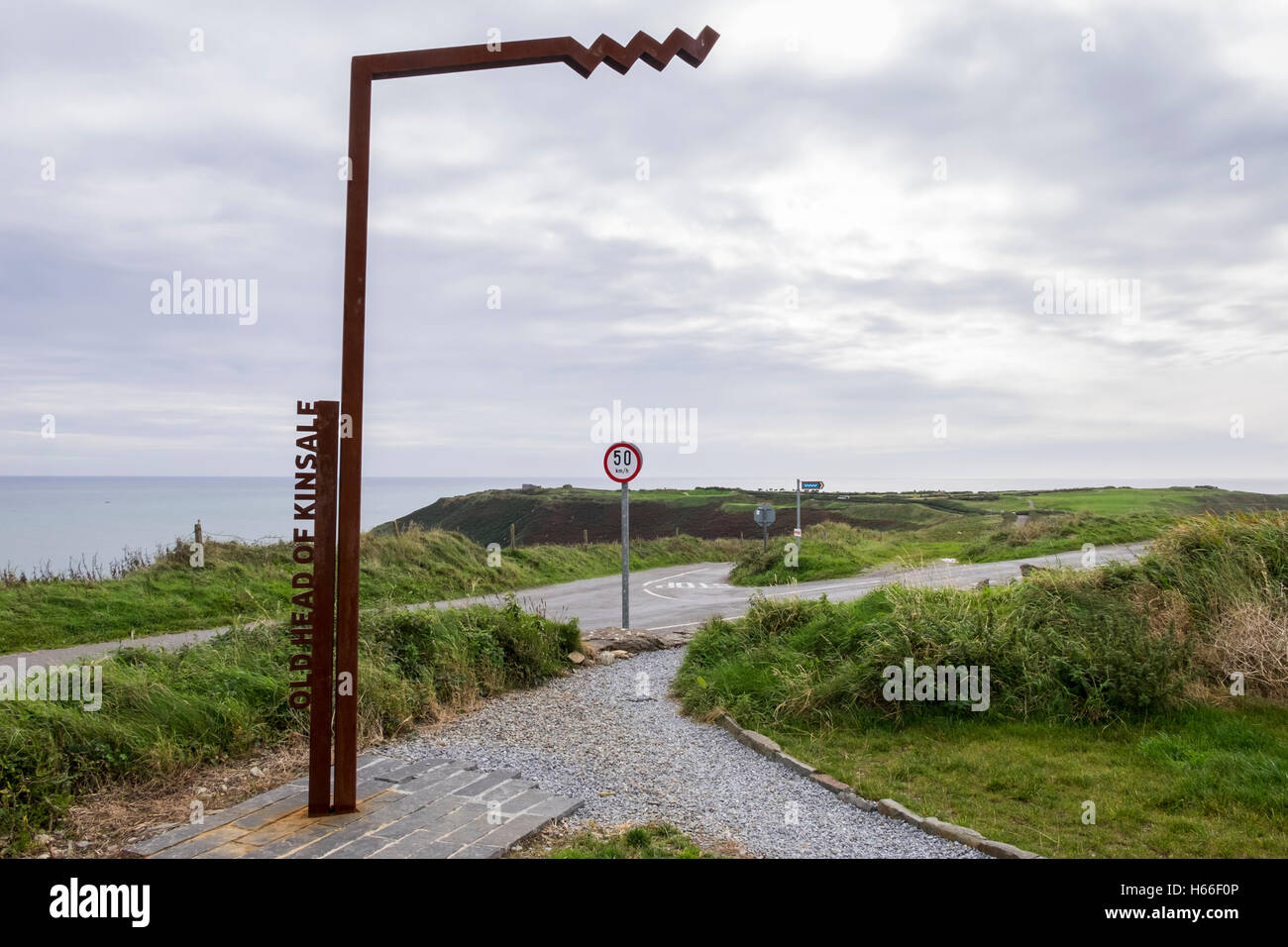 Rusted wrought iron marker sign at the Old Head of Kinsale, County Cork ...