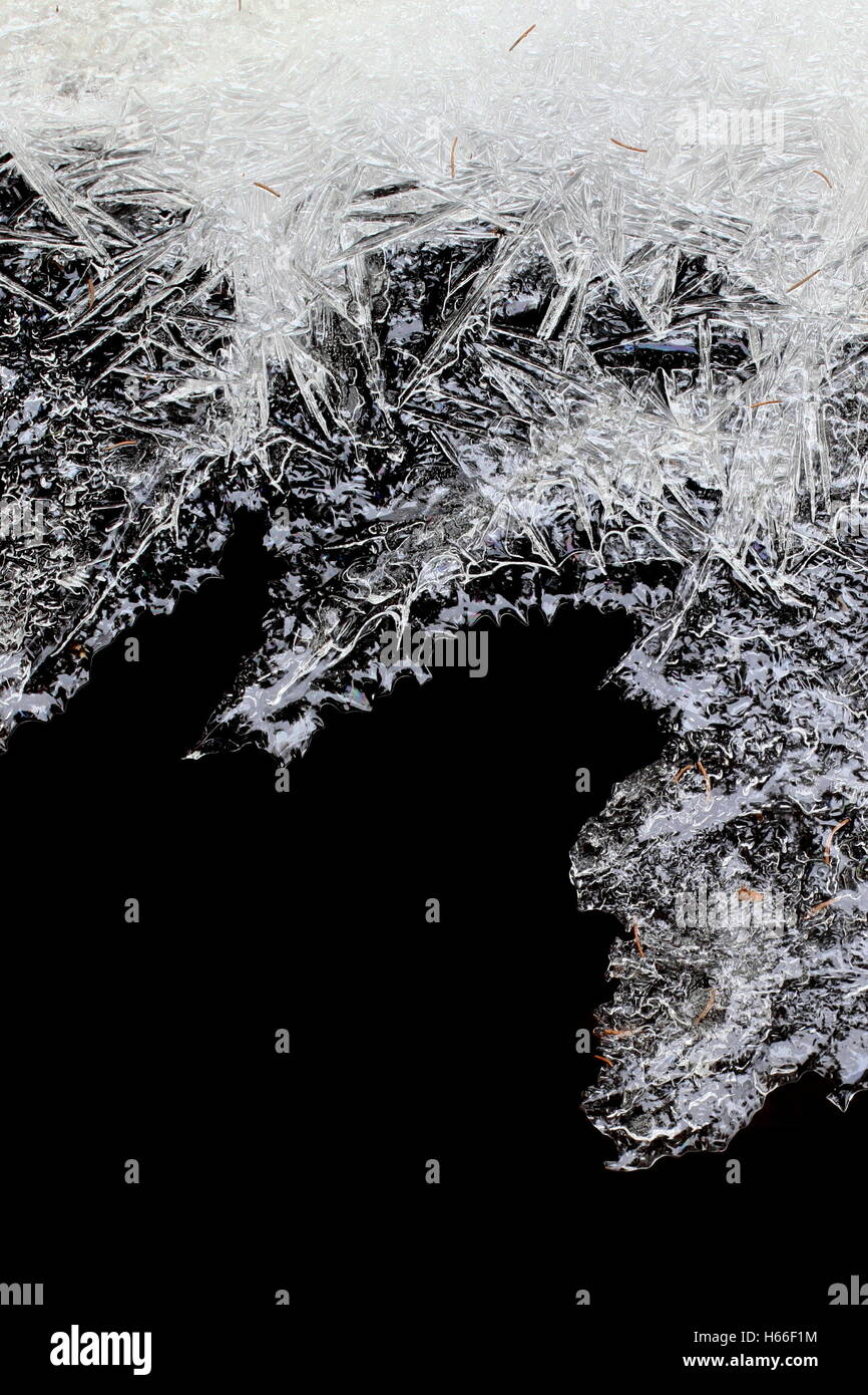 Crystals of ice on black background Stock Photo - Alamy