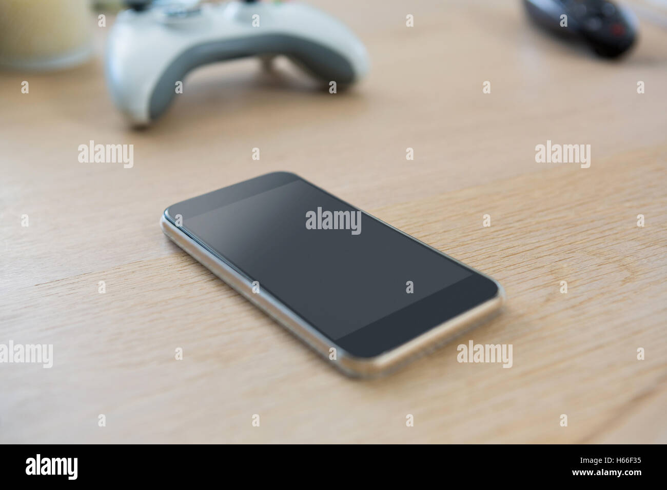 Mobile phone on a table Stock Photo - Alamy