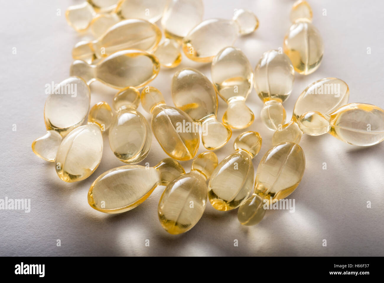 Golden capsules face serum hi-res stock photography and images - Alamy