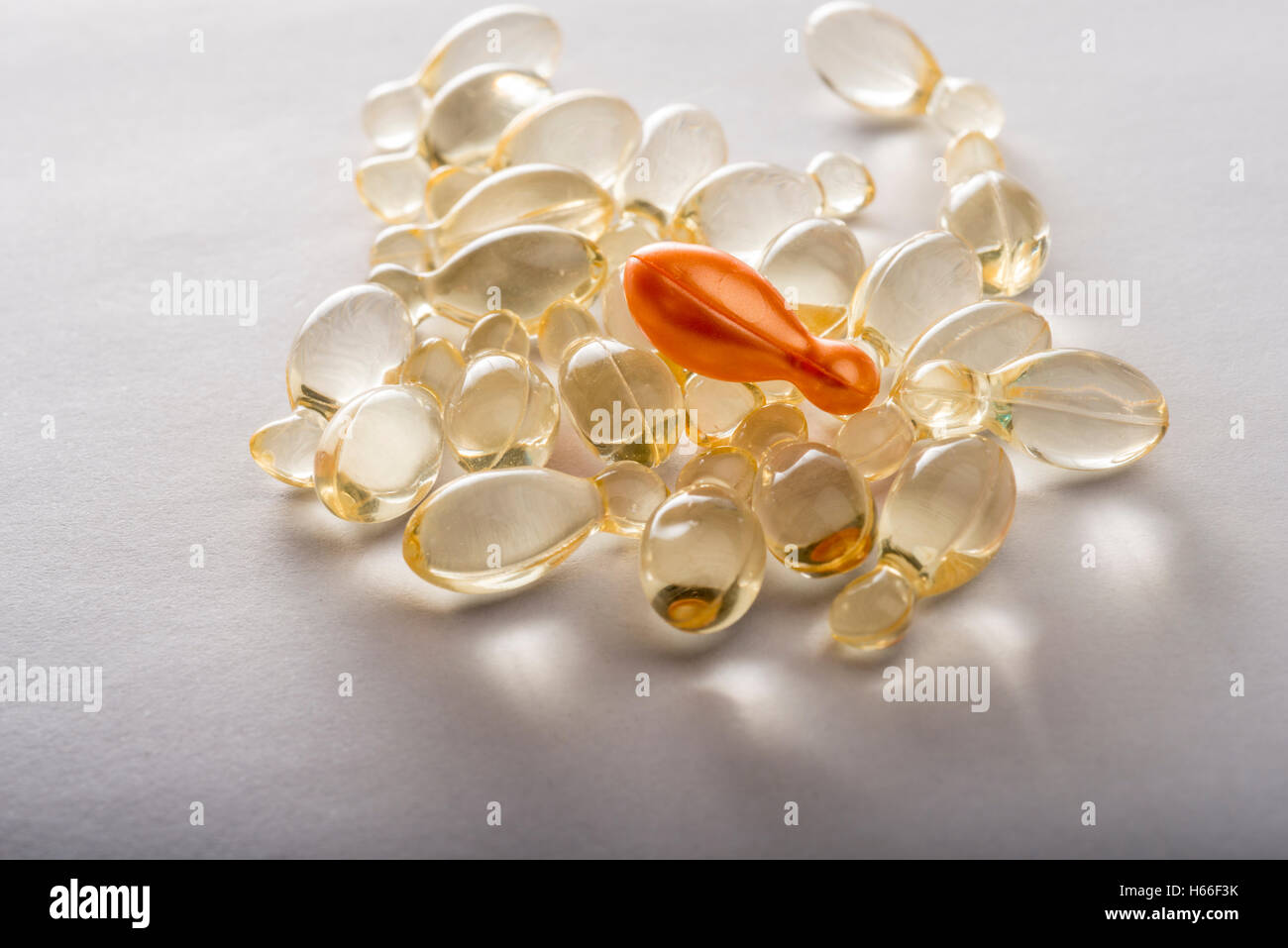 Gel capsules on the white background Stock Photo - Alamy