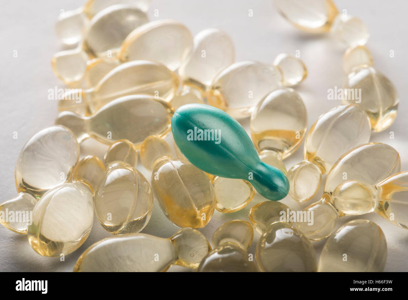 Gel capsules on the white background Stock Photo - Alamy