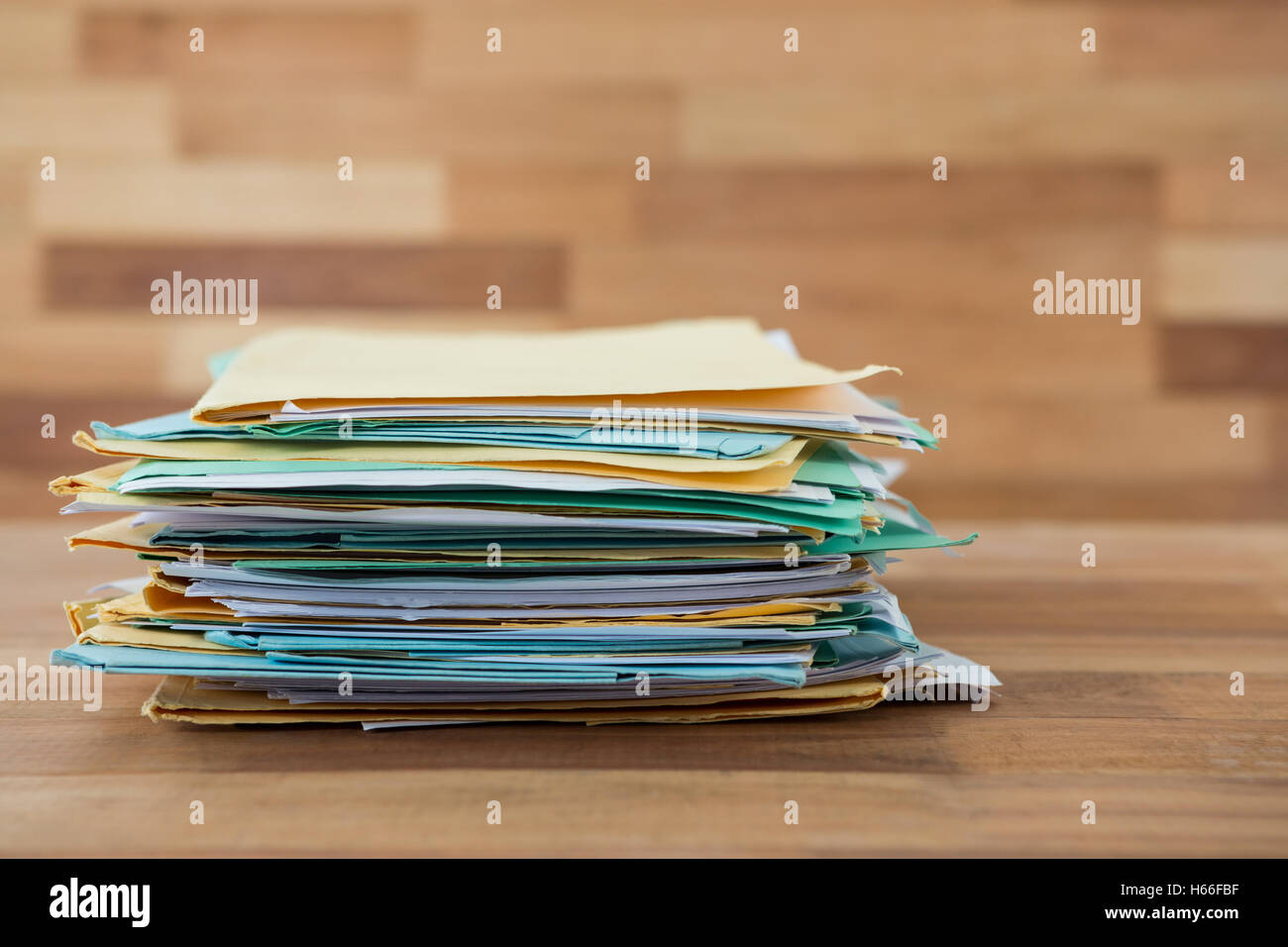 Stack of files on table Stock Photo - Alamy