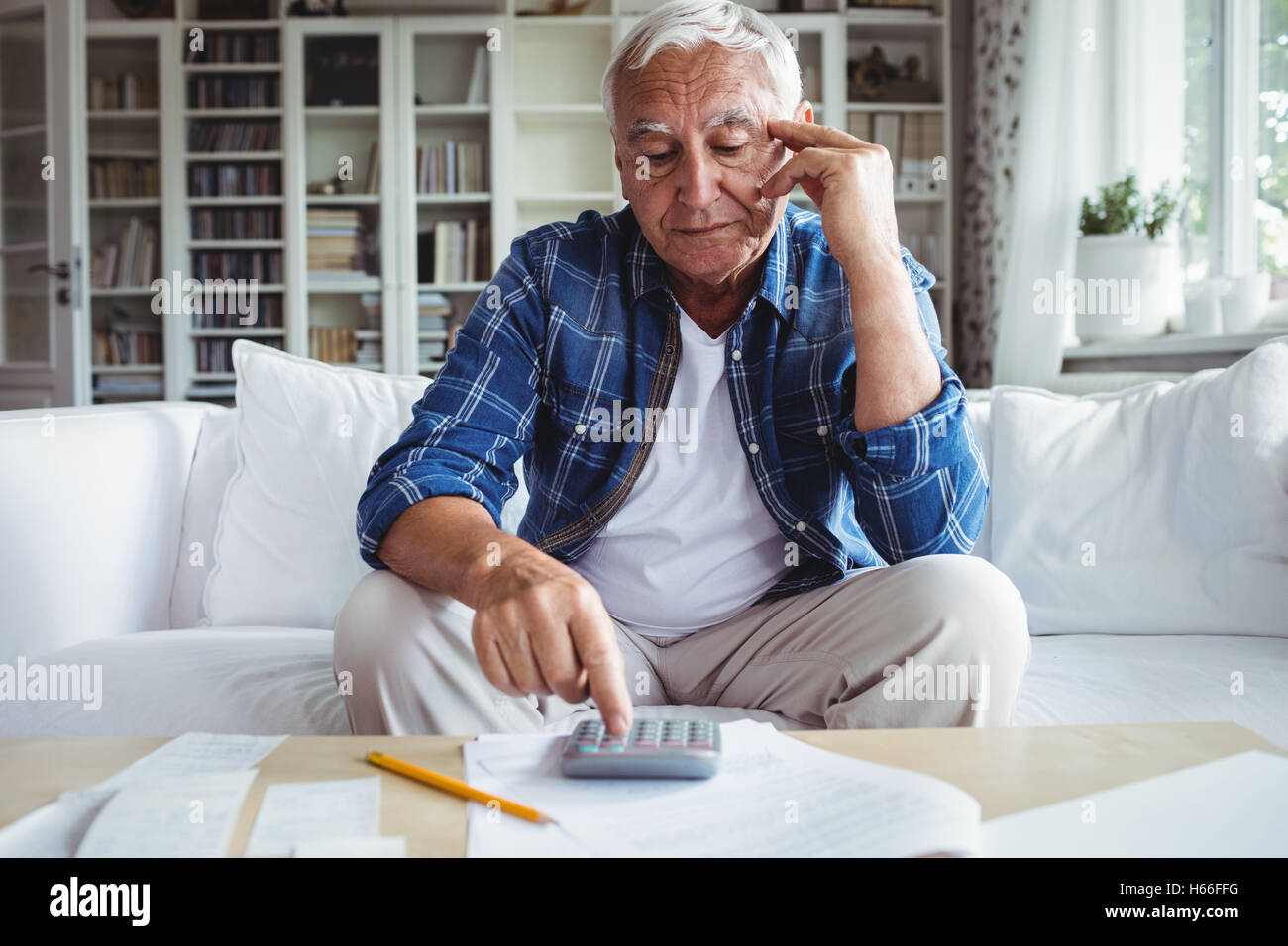 Senior man bills calculator hi-res stock photography and images - Alamy