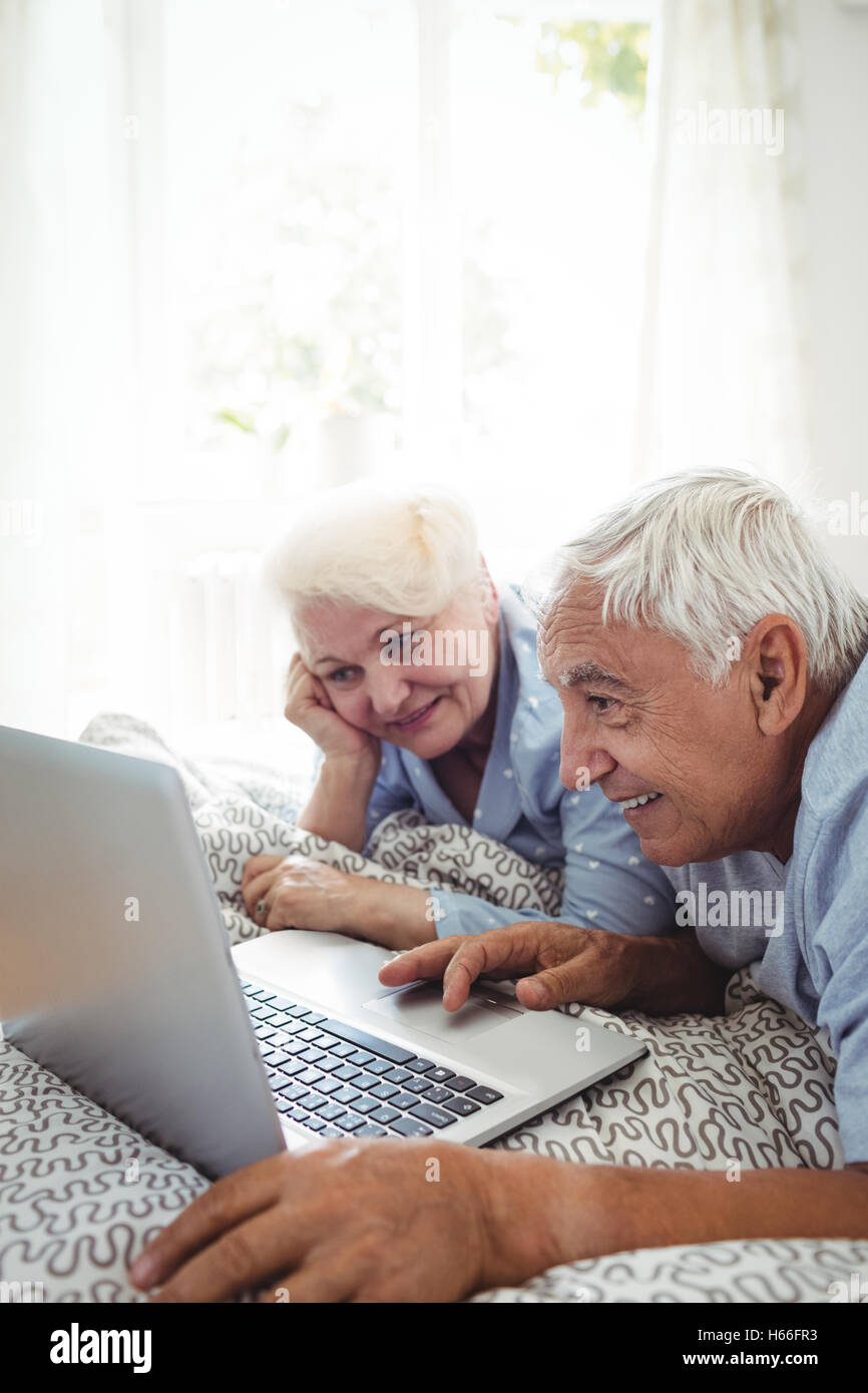 Senior couple using laptop Stock Photo - Alamy