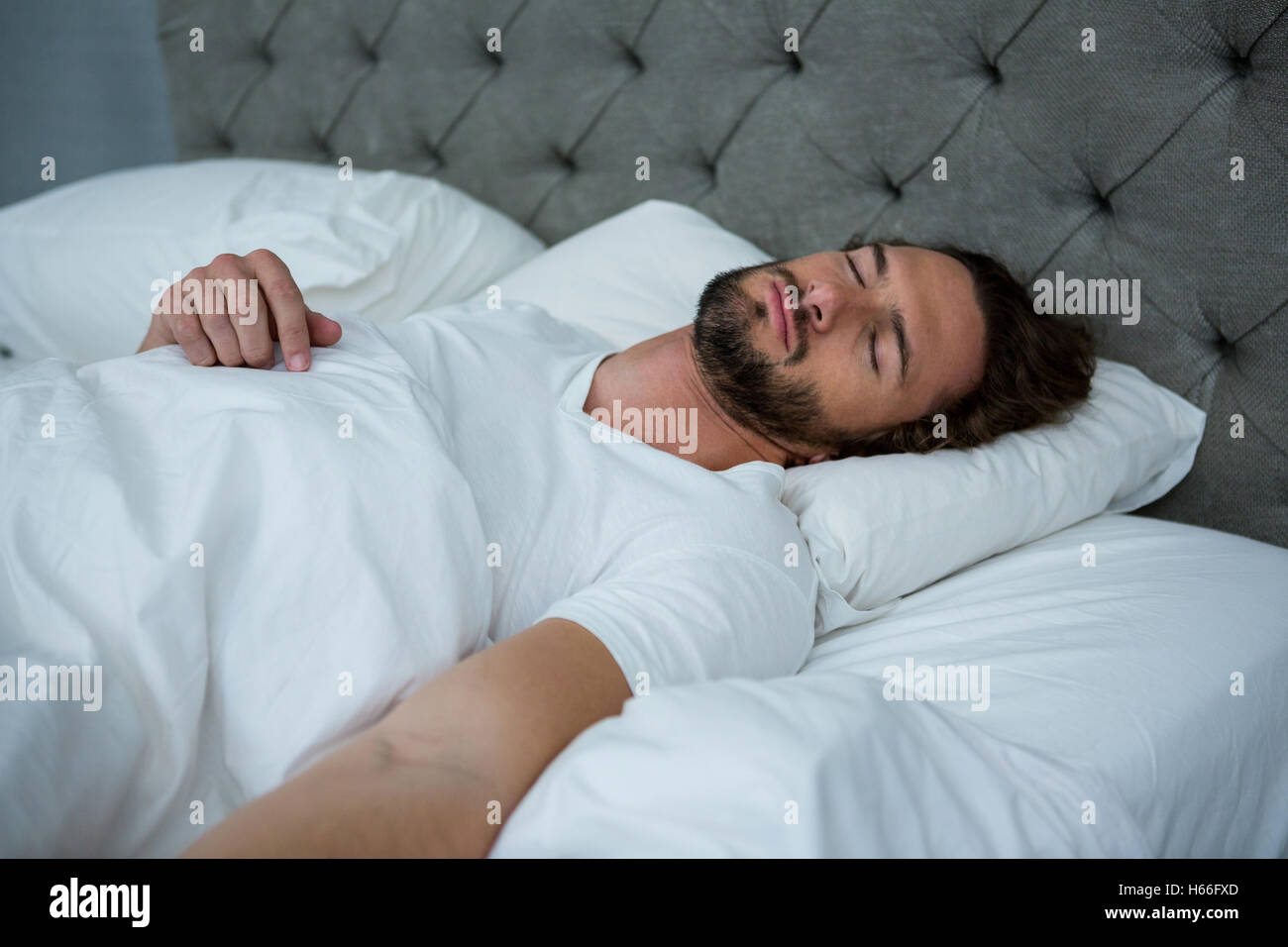 Sleeping man bed hi-res stock photography and images - Alamy