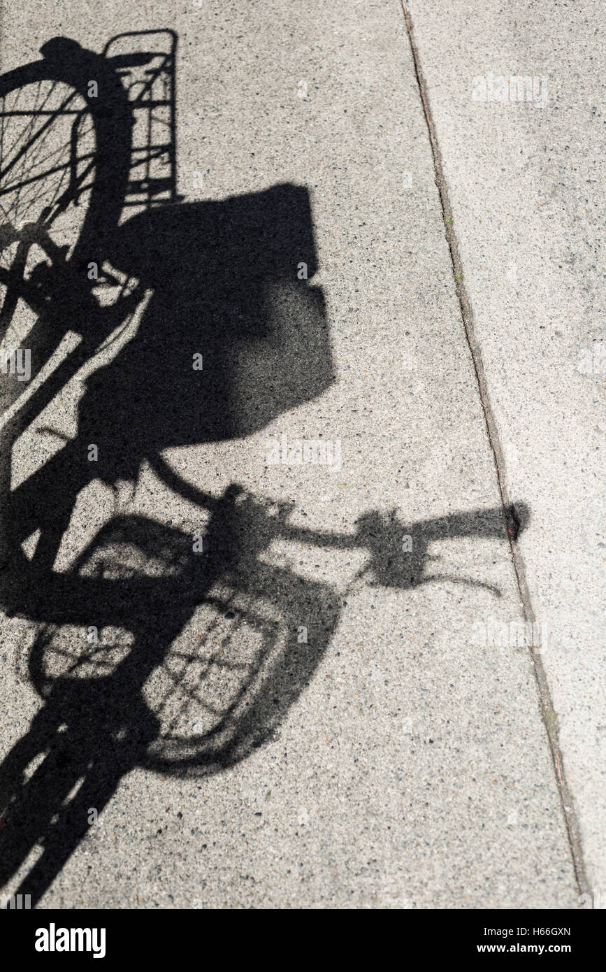 Shadow of cycle on a concrete road Stock Photo - Alamy