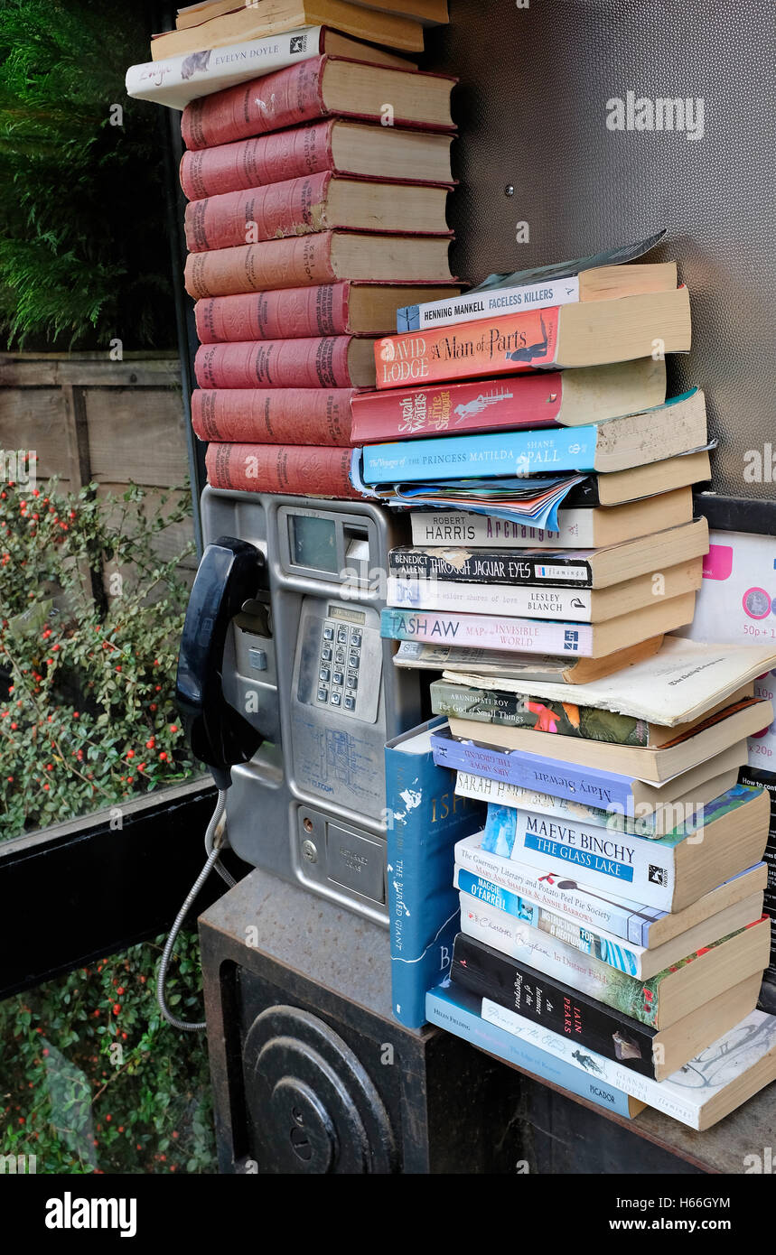 local telephone box mini lending library Stock Photo - Alamy