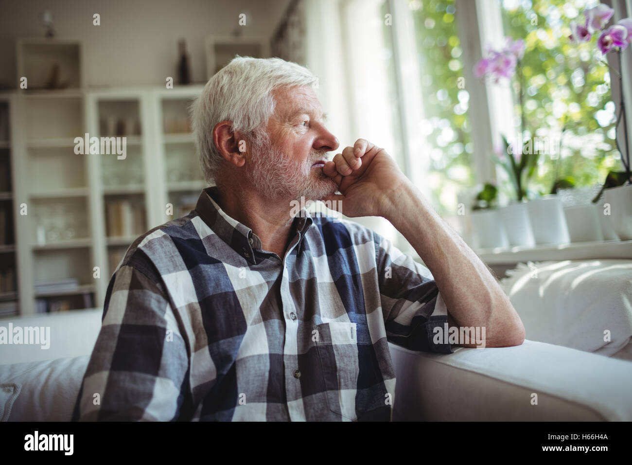 Thoughtful senior man hi-res stock photography and images - Alamy