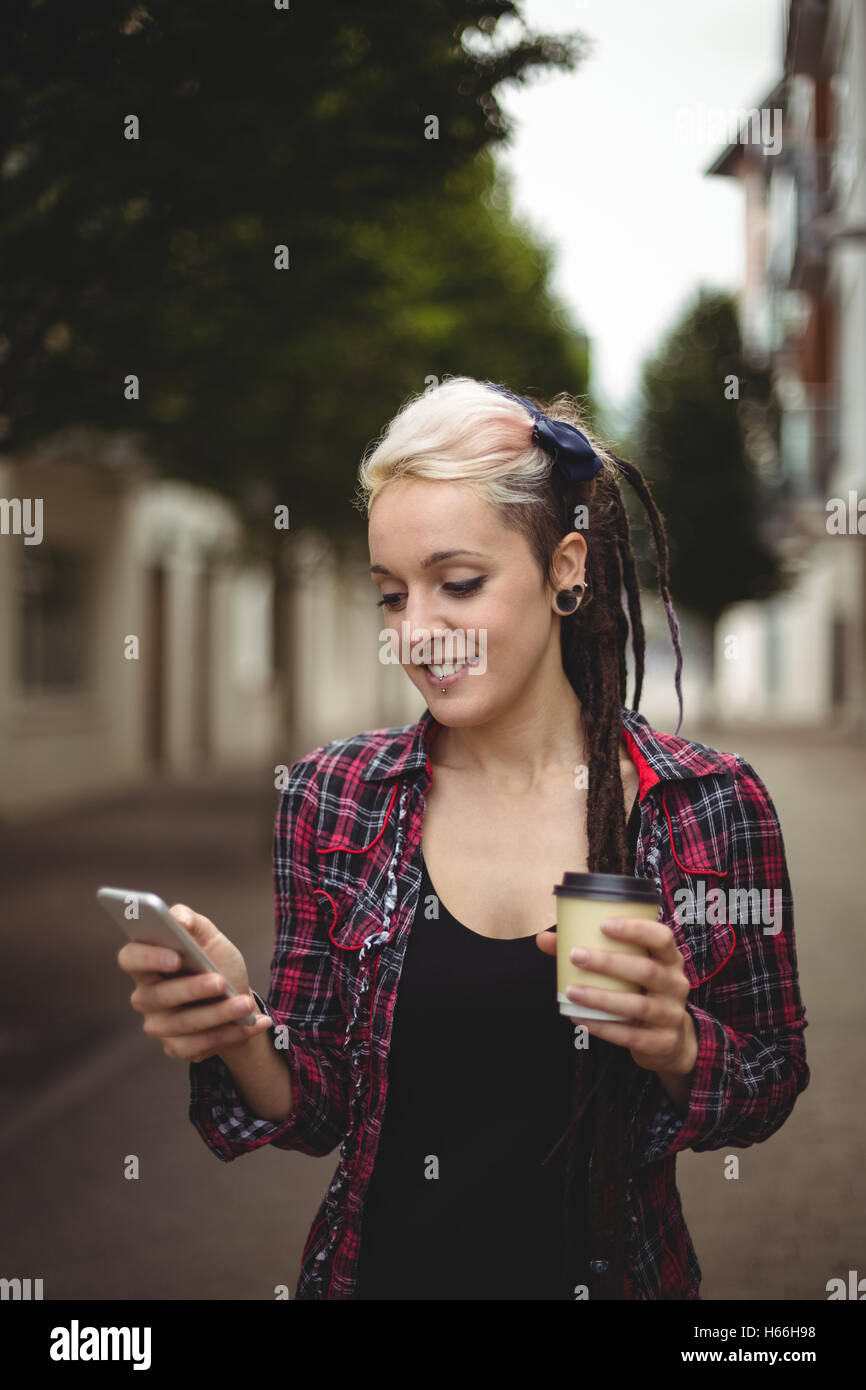 Mobile phone smiling walking hi-res stock photography and images - Alamy