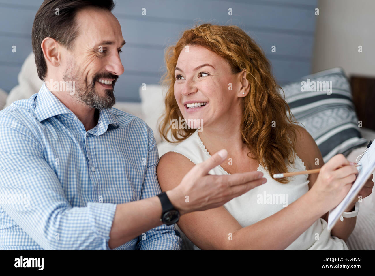 Business couple discussing important notes Stock Photo - Alamy