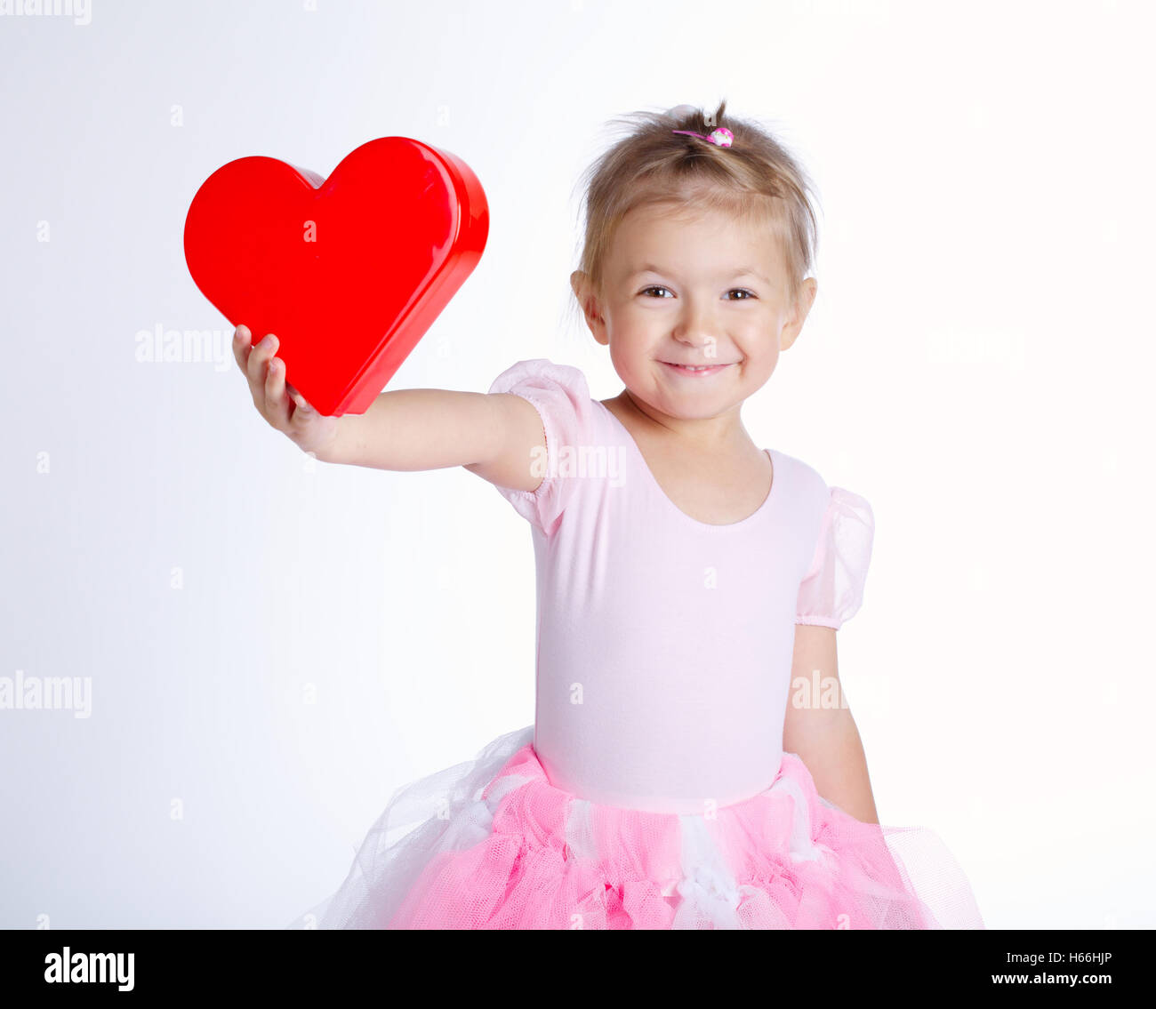 beautiful young girl with heart Stock Photo - Alamy
