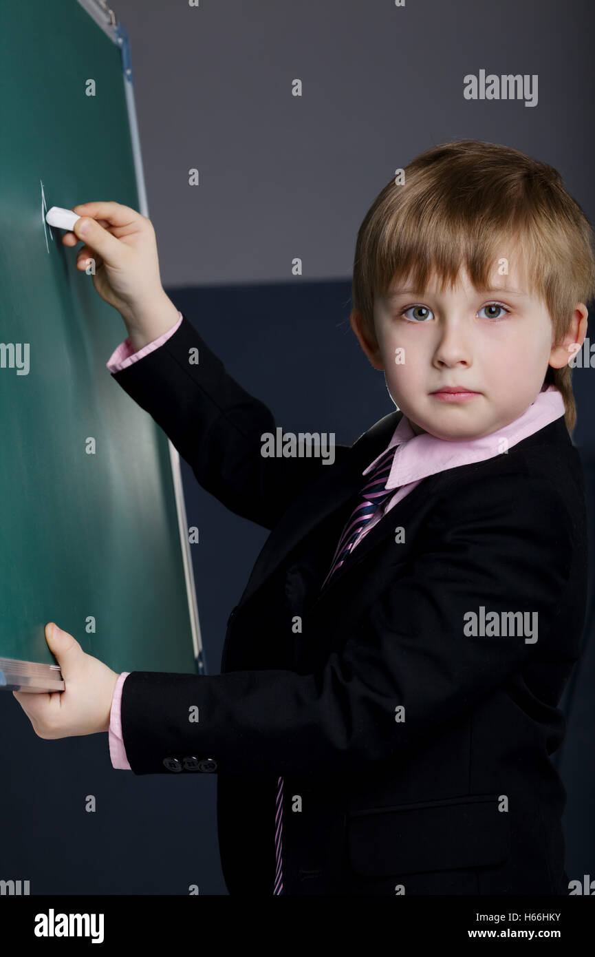 little funny boy with blackboard Stock Photo - Alamy