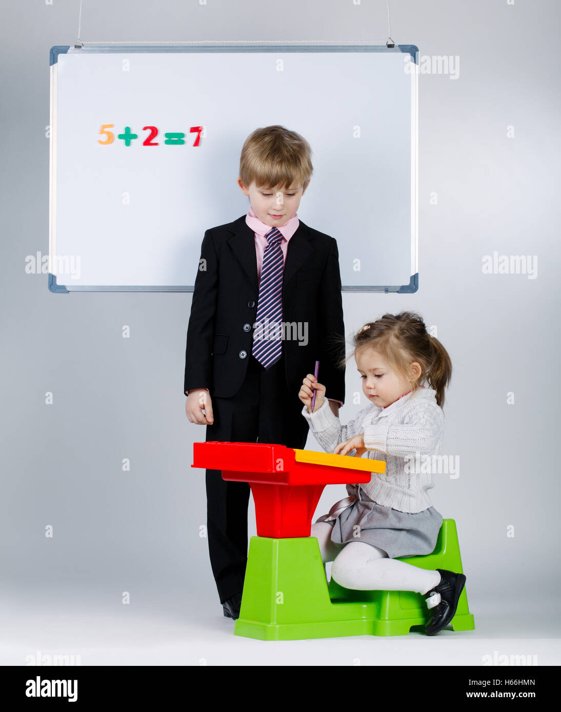 young boy teaching sister Stock Photo - Alamy