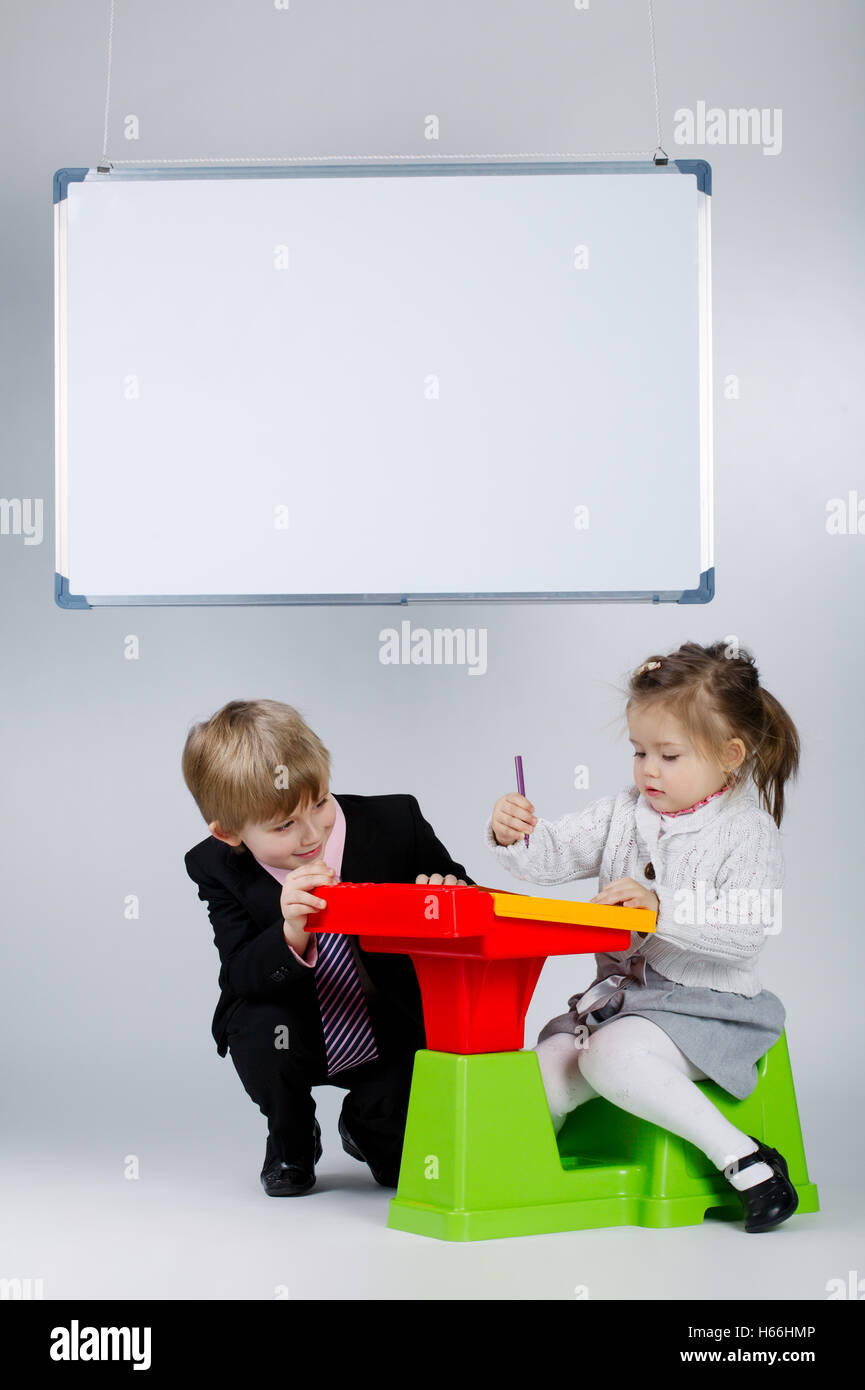 young boy teaching sister Stock Photo - Alamy