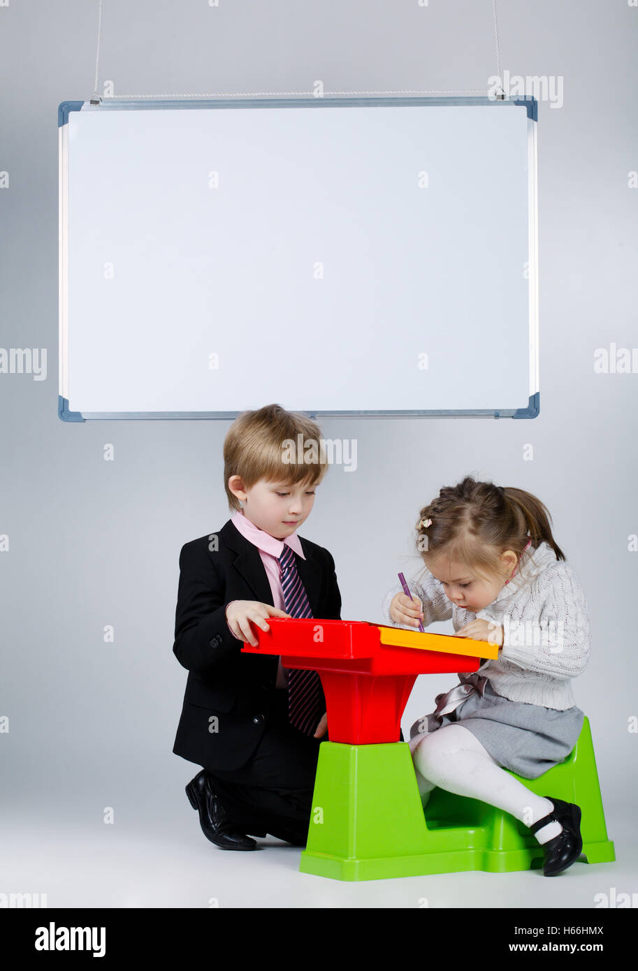 young boy teaching sister Stock Photo - Alamy