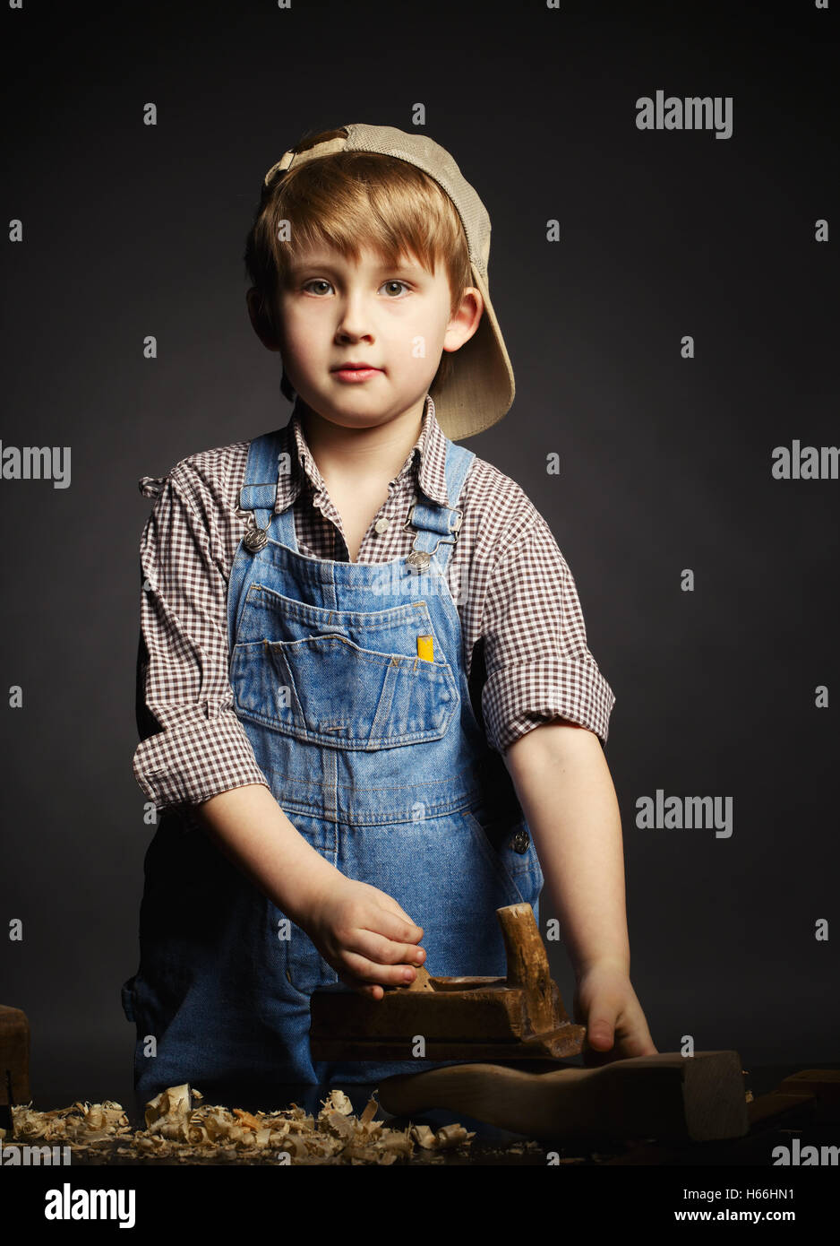 little boy working with plane Stock Photo - Alamy