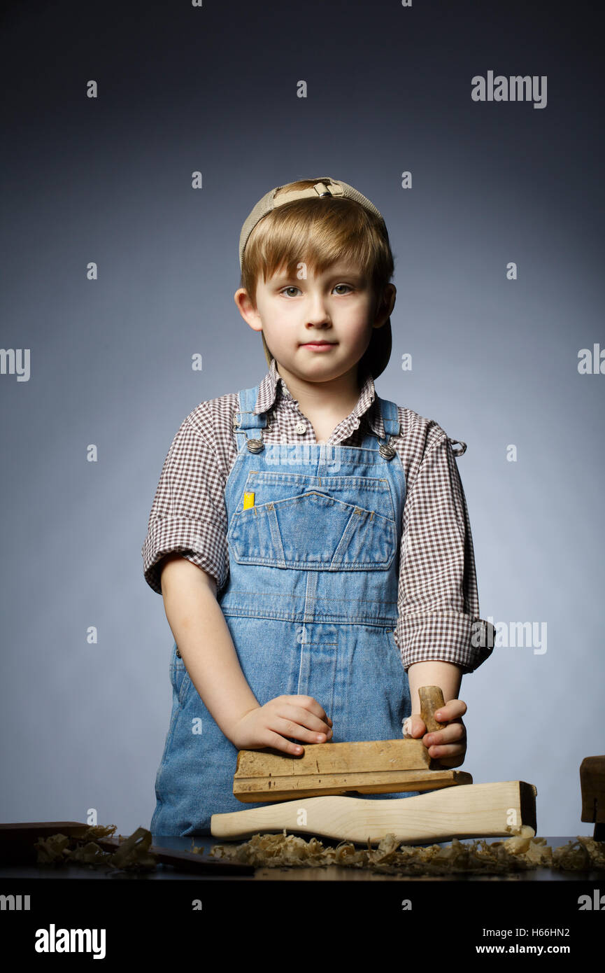 little boy working with plane Stock Photo - Alamy