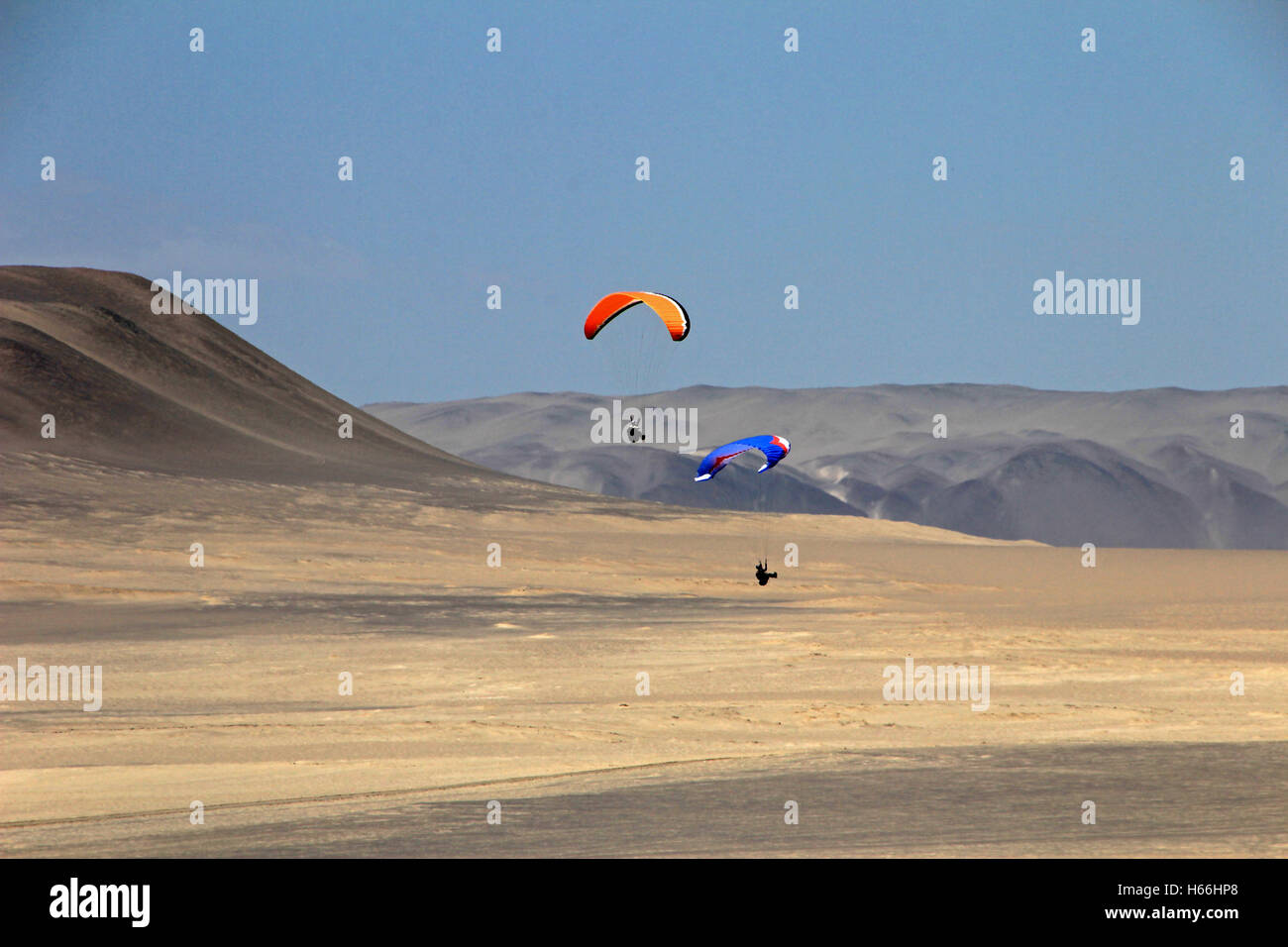 Paraglider over the cliffs of Paracas Peru Stock Photo - Alamy