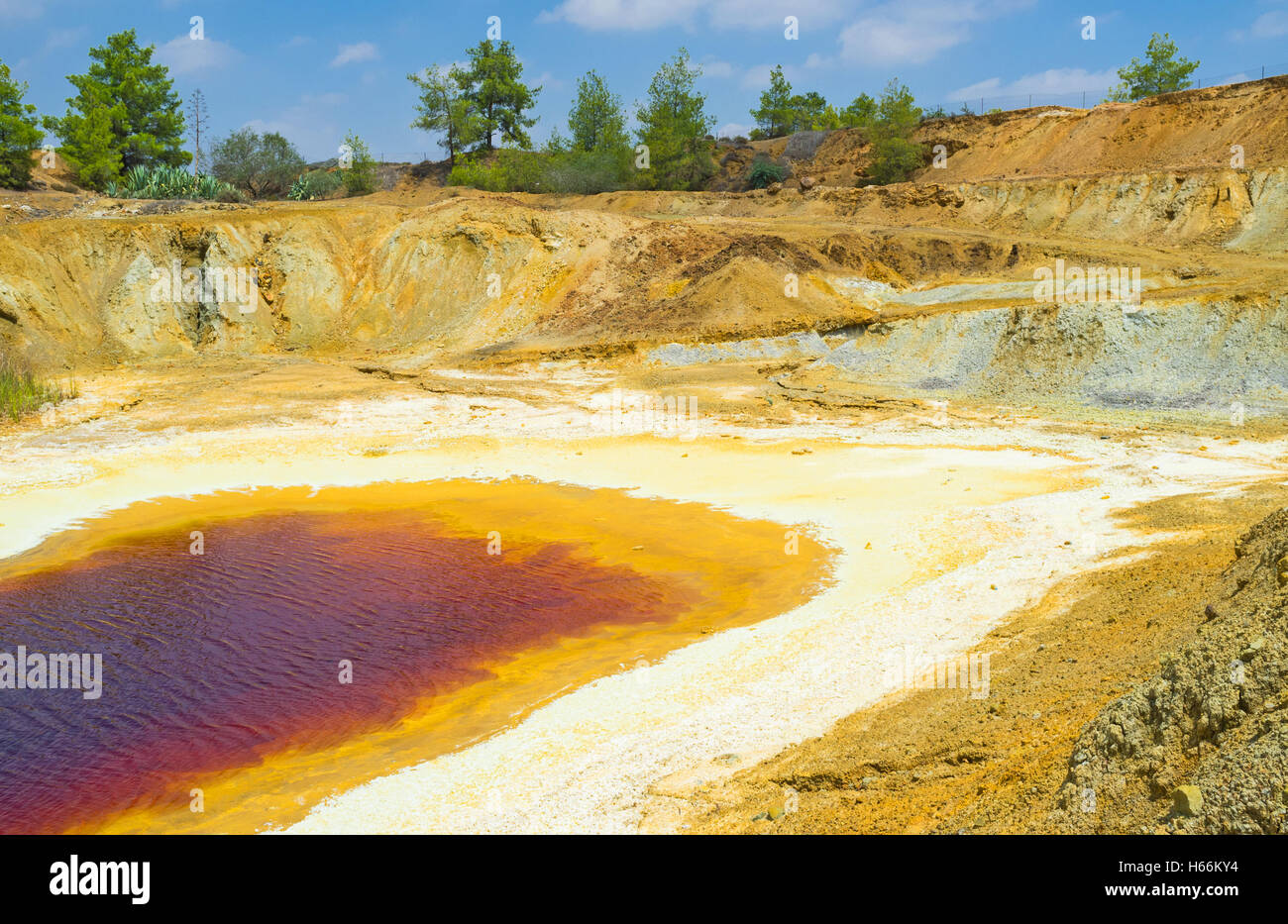 The mine lake has red waters and yellow banks due to crystallized ...