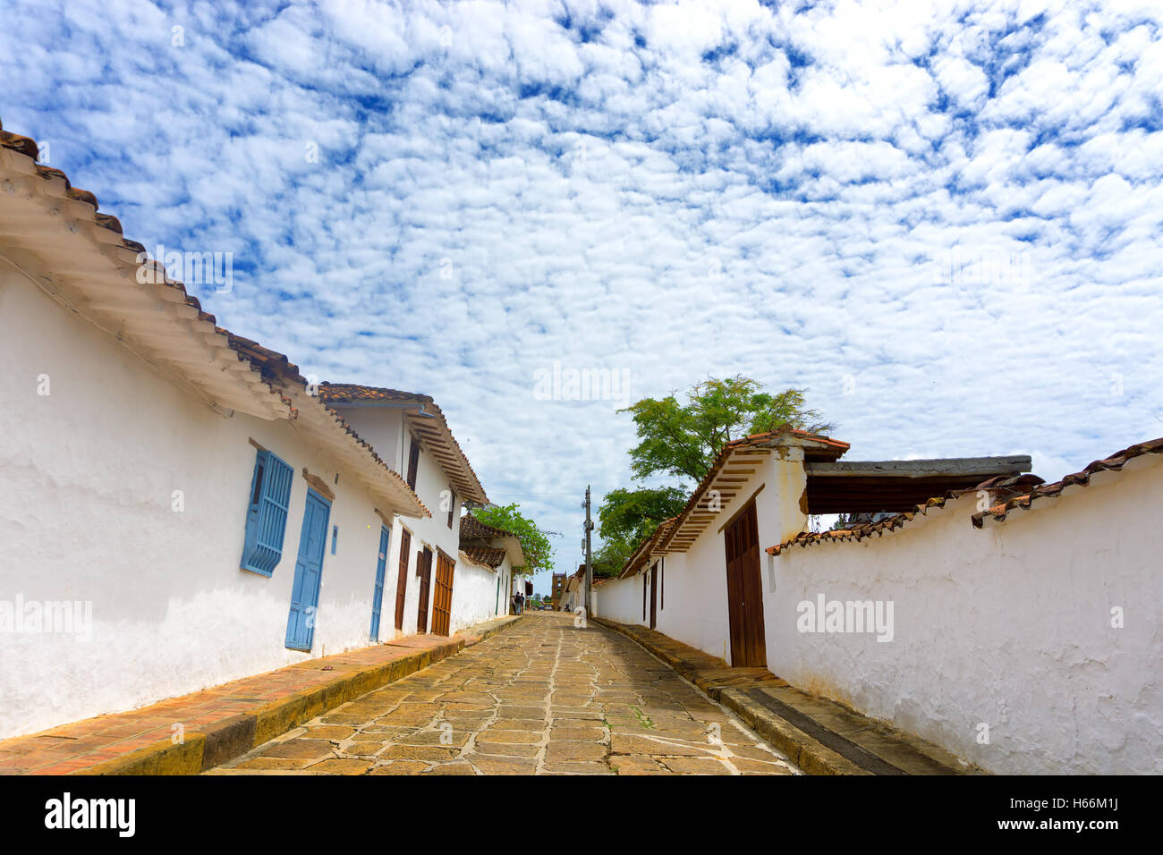 Sandstone street and white colonial architecture in Barichara, Colombia ...