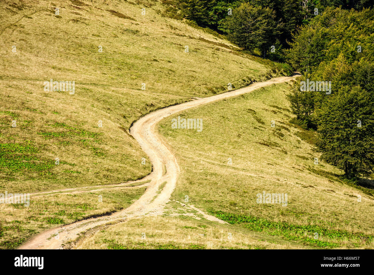 mountain landscape. travers path through hill side to the mountain top ...