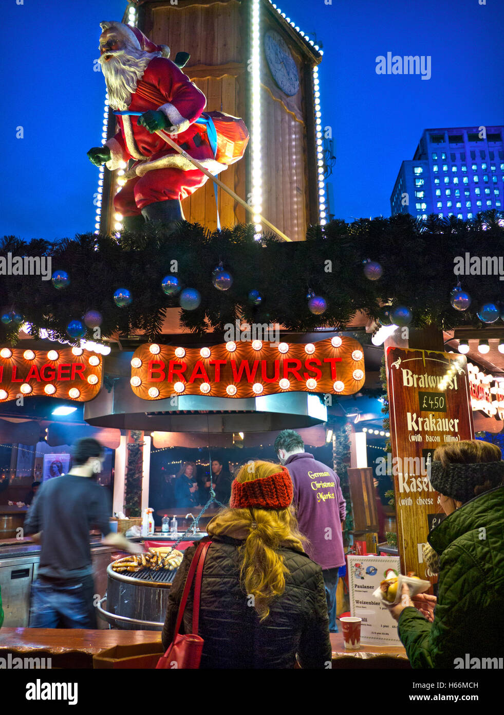 German Christmas market food stall illuminated at night South Bank ...