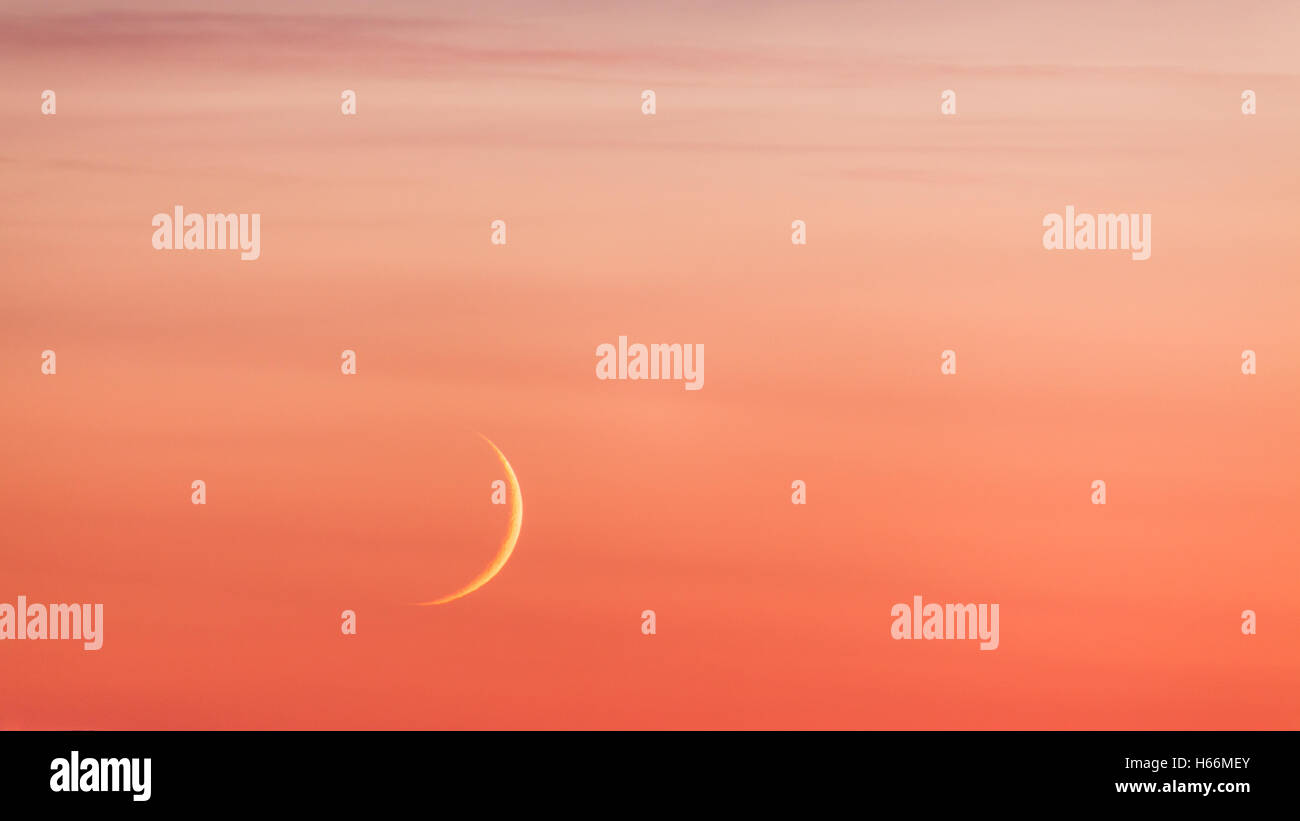 Moon crescent and pastel colors sunset sky Stock Photo - Alamy