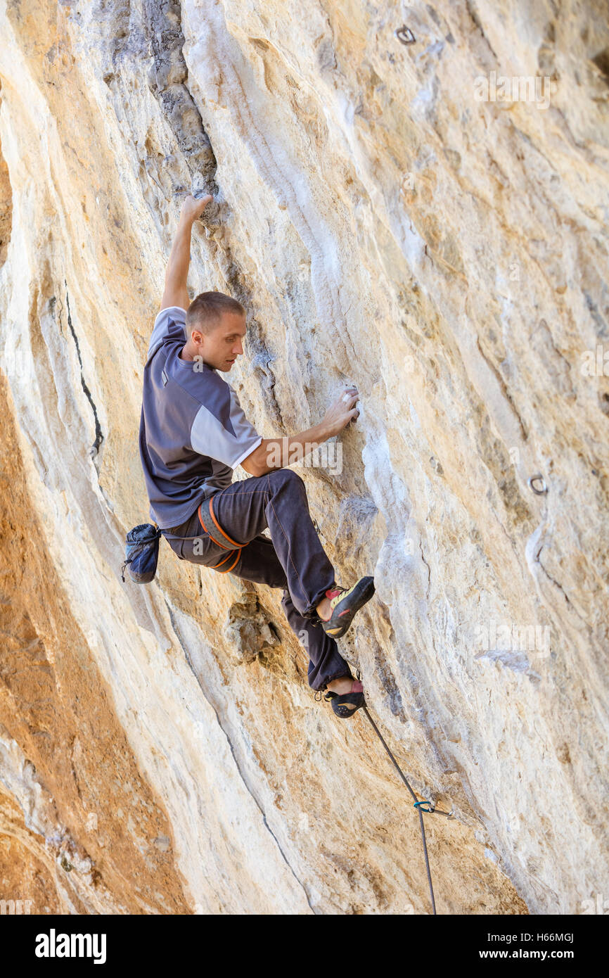 Rock climber on a face of a cliff Stock Photo - Alamy