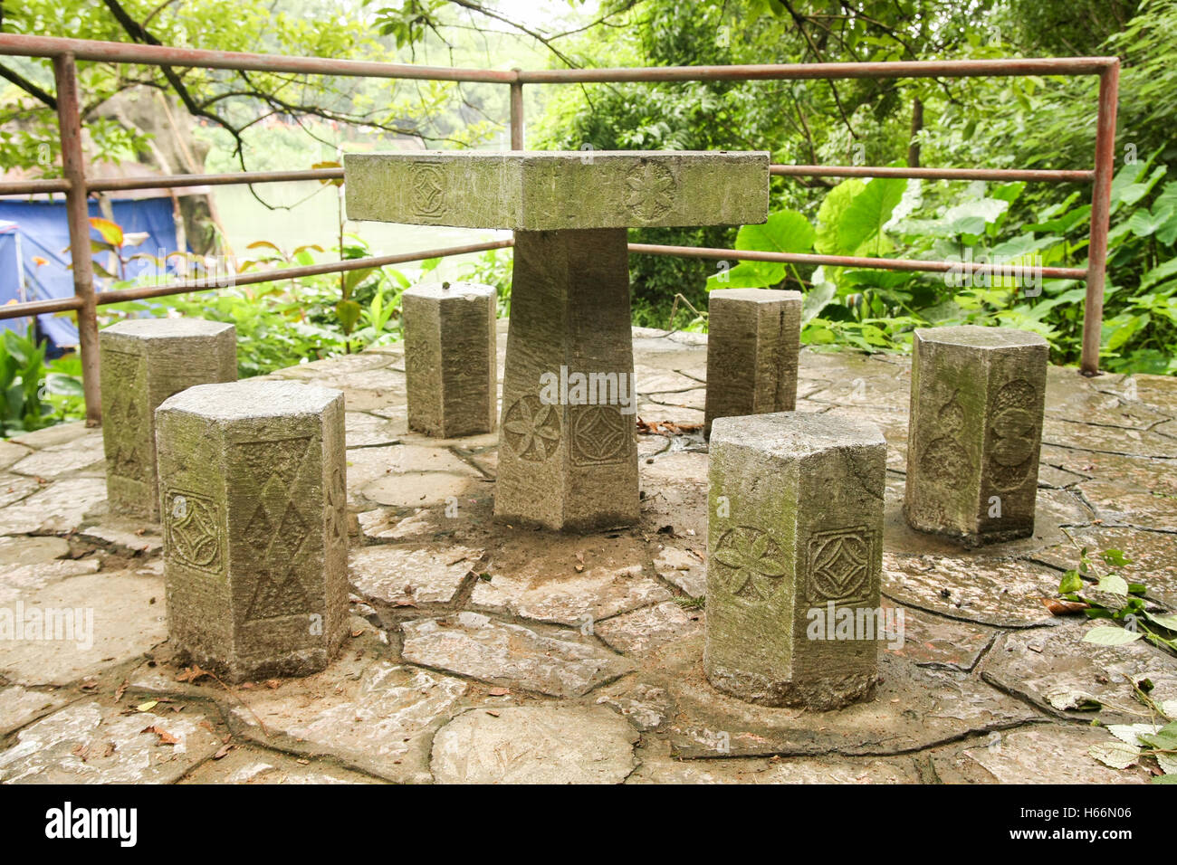 Stone table and stools Stock Photo - Alamy