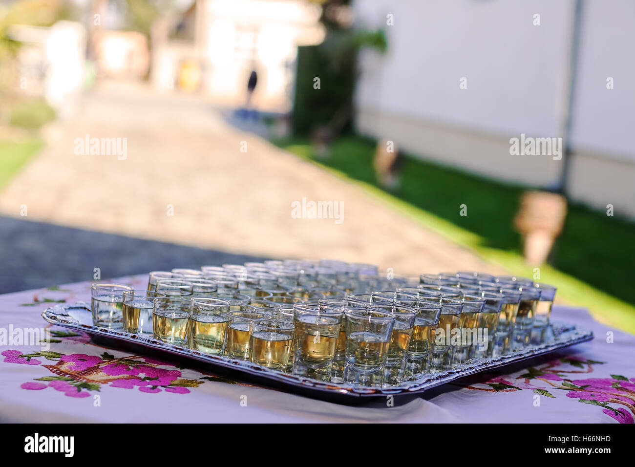 a traditional alcoholic drink on a tray, note shallow depth of field ...