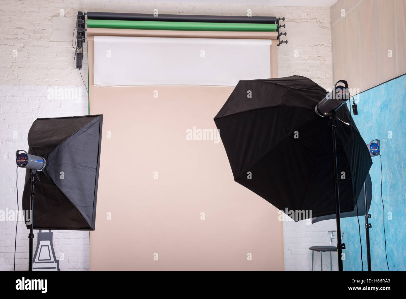 Empty photo studio with lighting equipment and paper background ready ...