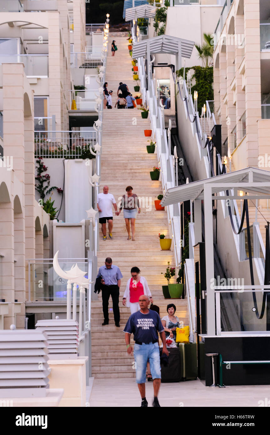 People walking up and down a tall set of outdoor steps at a hotel Stock ...