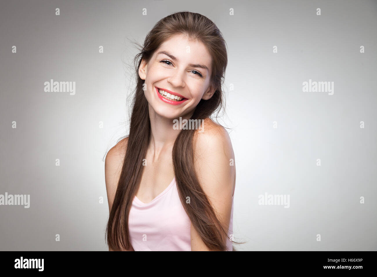 Portrait of smiling girl posing at camera Stock Photo - Alamy