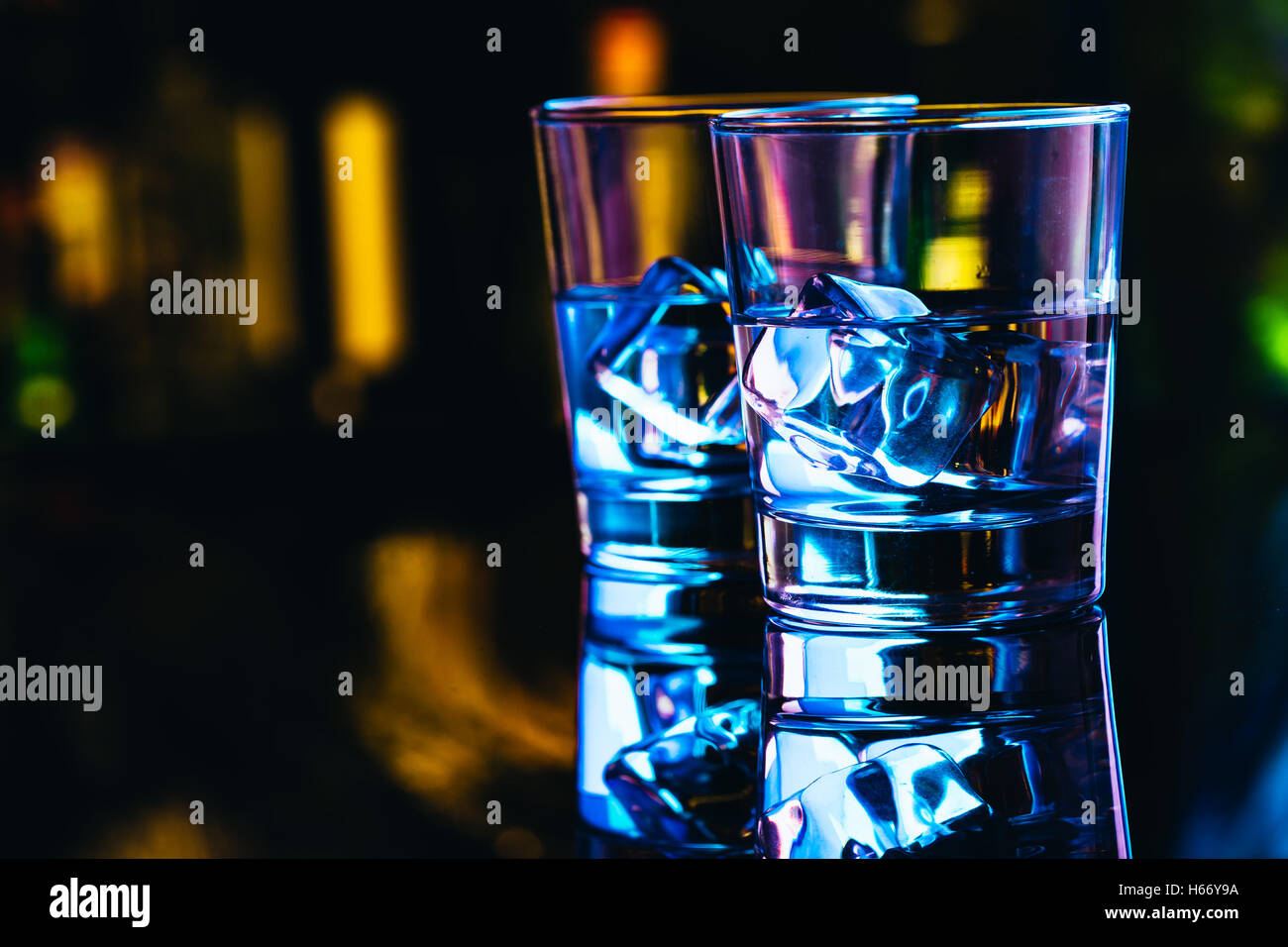 Two glasses of vodka with ice closeup Stock Photo - Alamy
