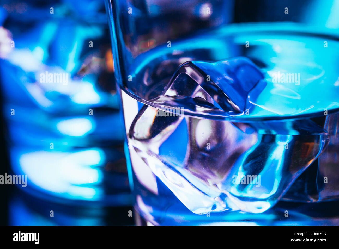 Two glasses of vodka with ice closeup Stock Photo - Alamy