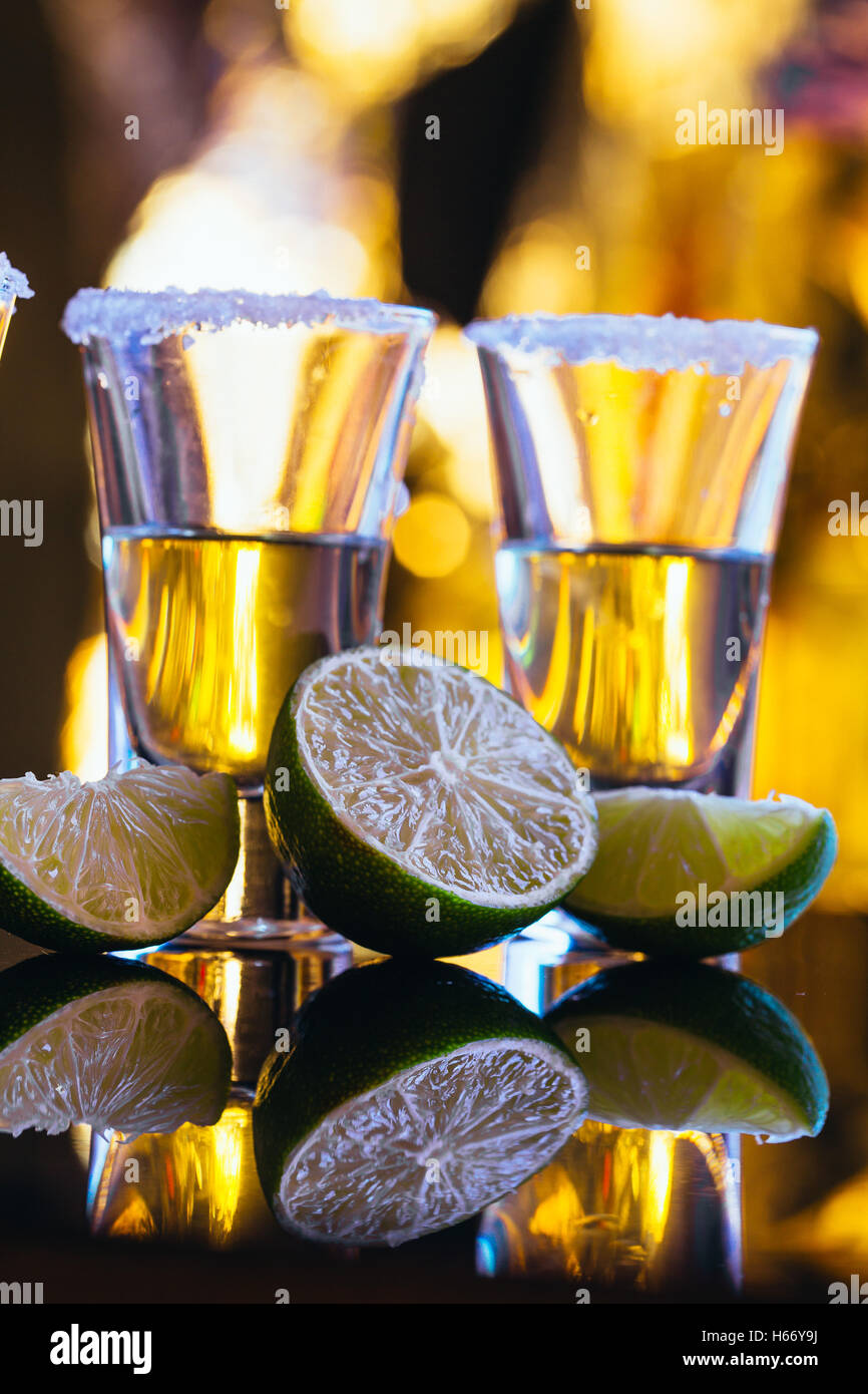 stack of tequila with salt close up on blurred background Stock Photo ...