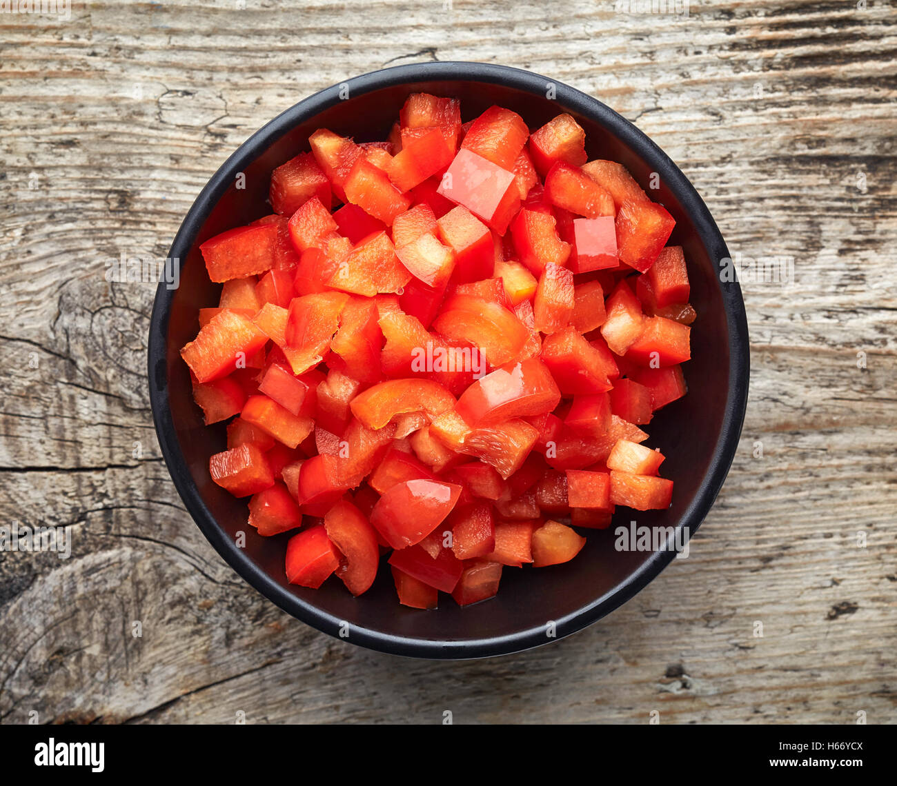 Bowl of chopped bell pepper isolated on white background, top view ...