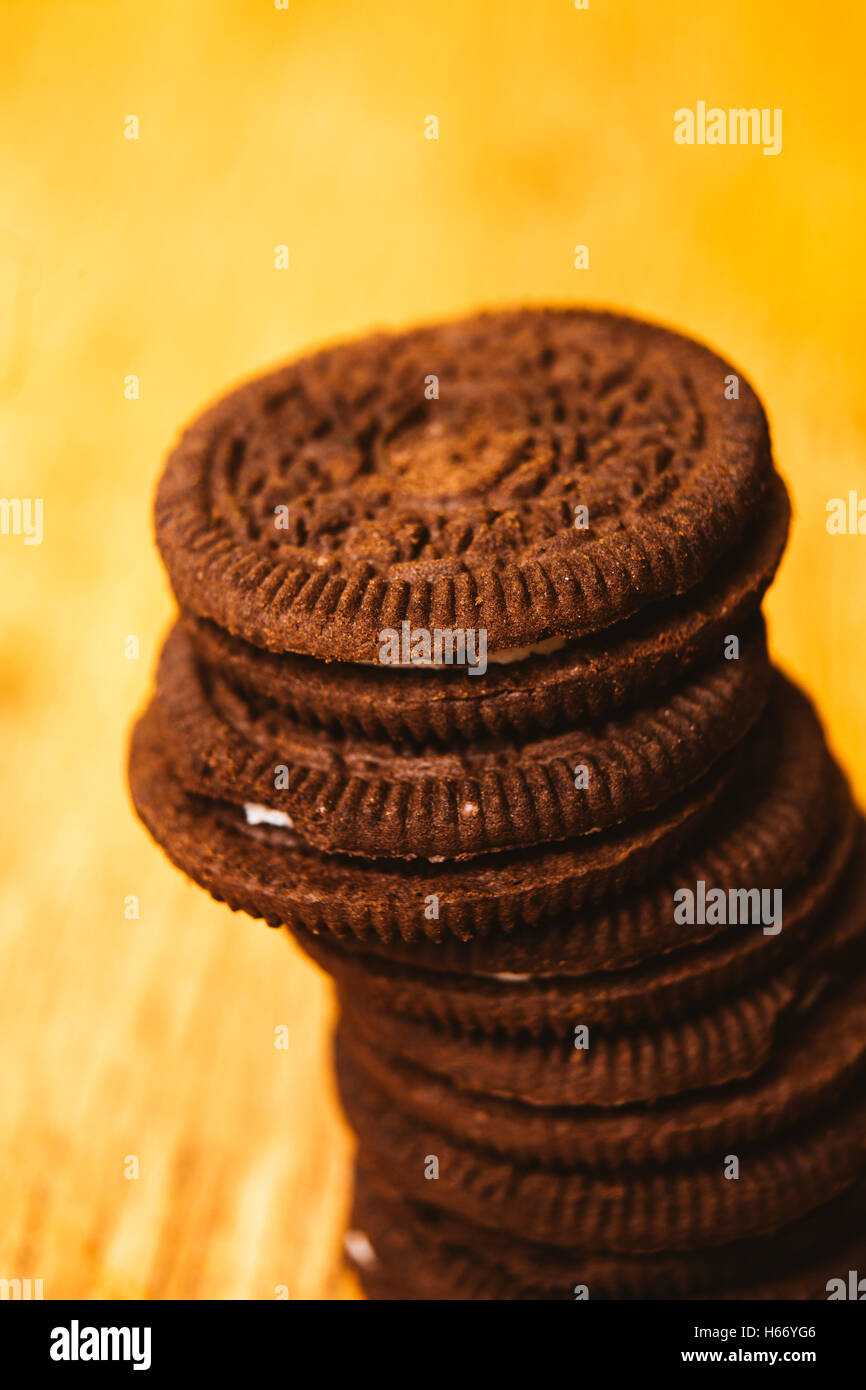 stack of cookies on dark blurred background Stock Photo - Alamy