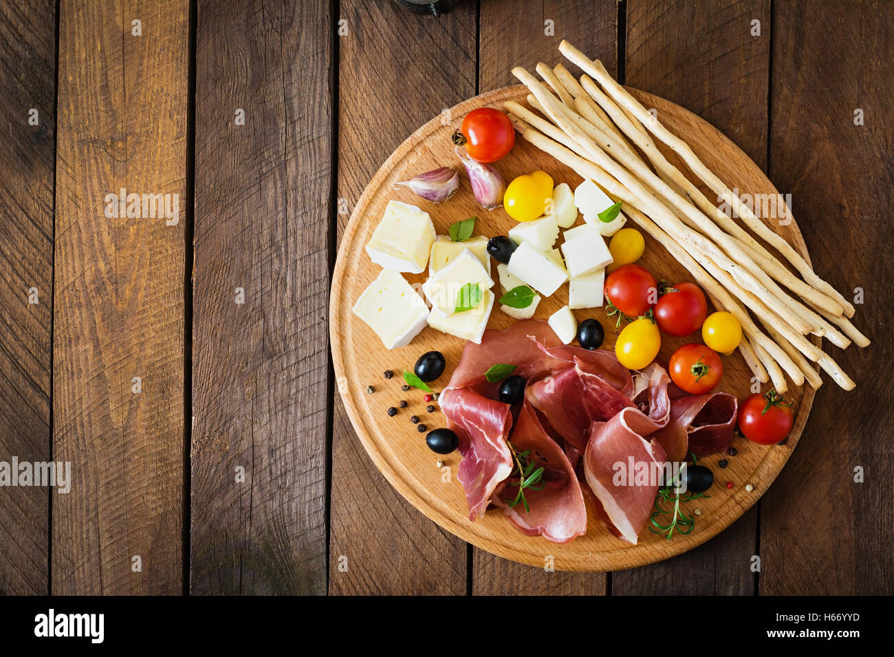 Meat appetizer on a plate on old wooden background. Top view Stock ...